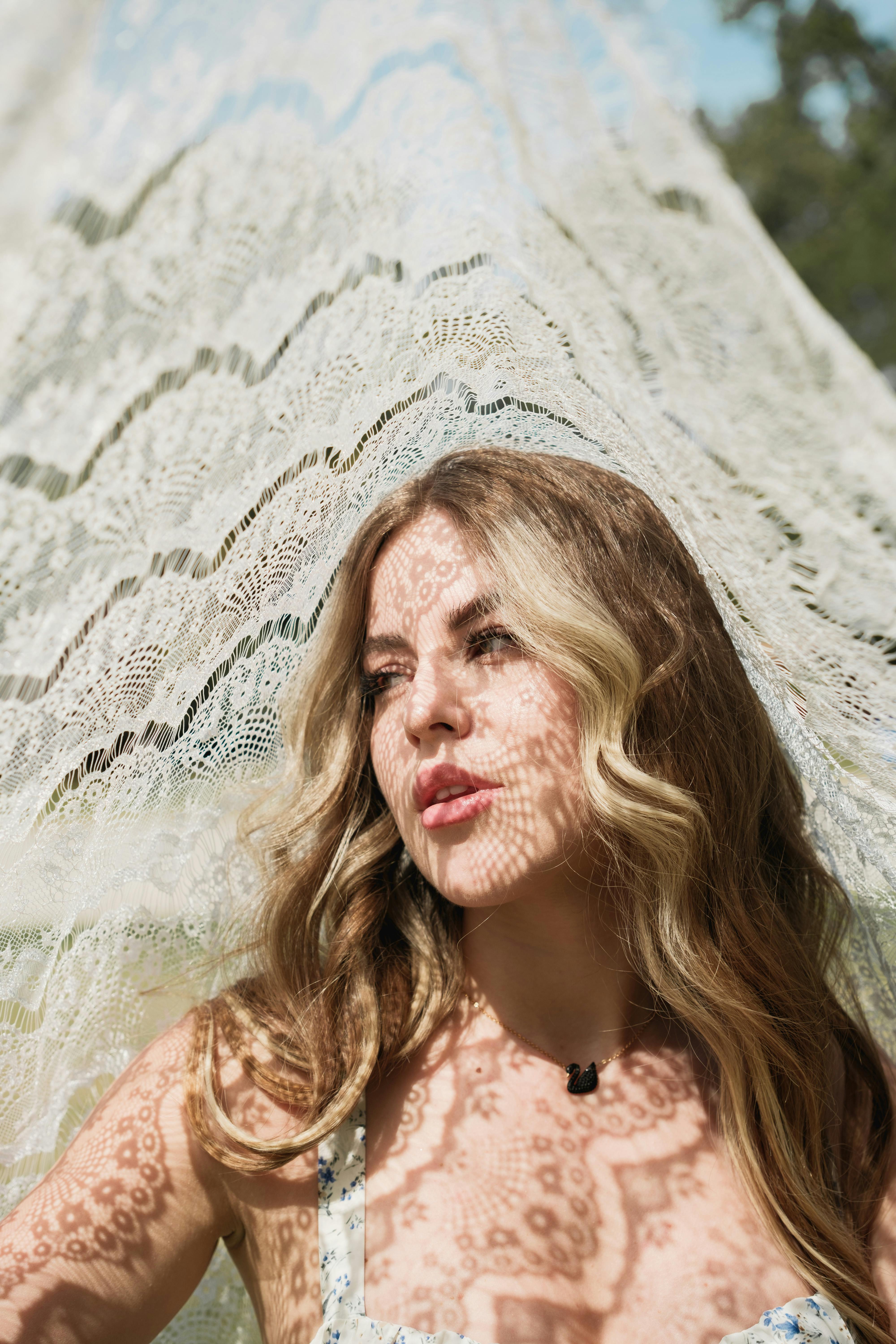 Sunny Portrait with Lace Shadows Outdoors · Free Stock Photo