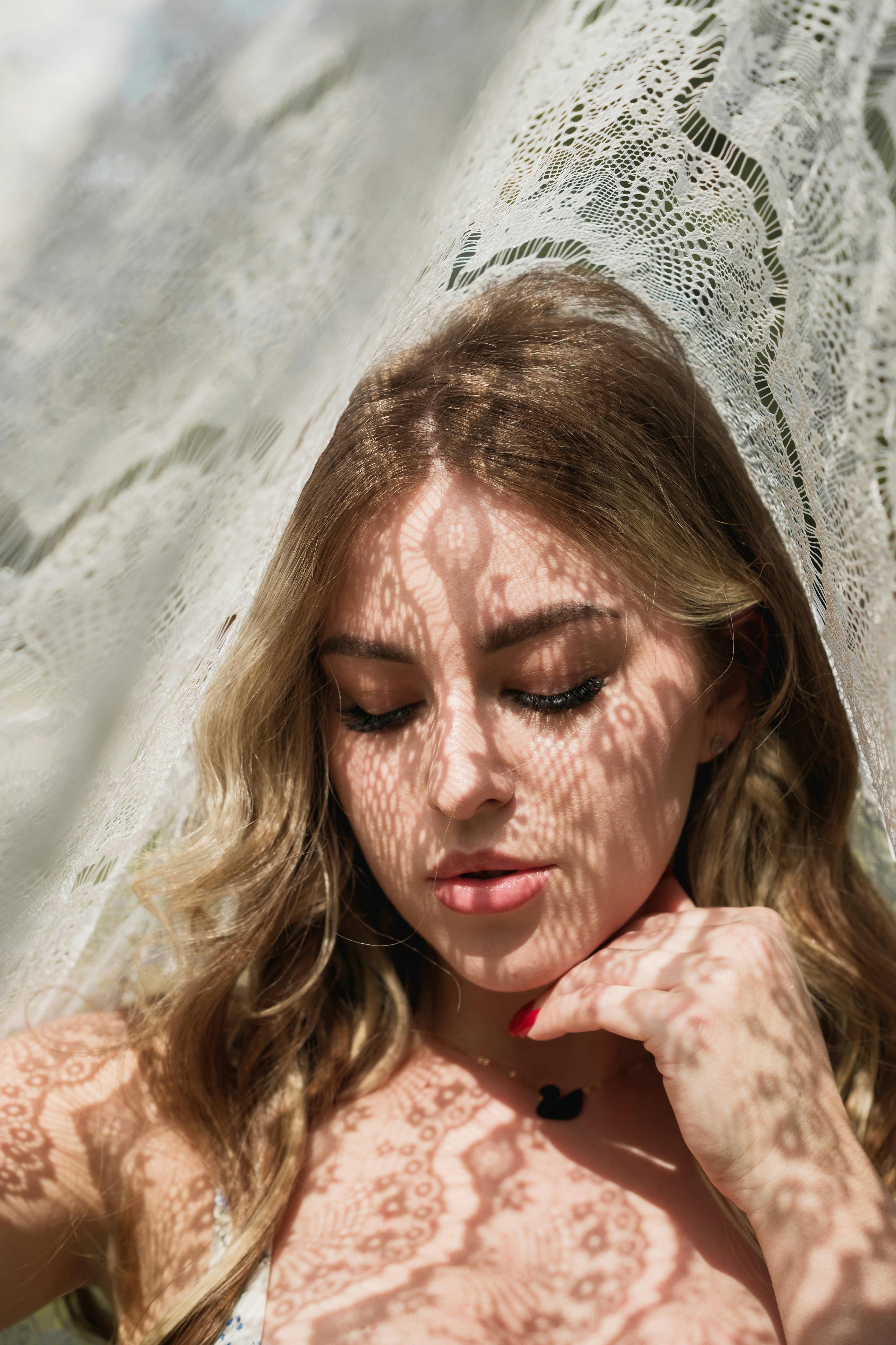 Artistic Portrait with Lace Shadows and Soft Light · Free Stock Photo