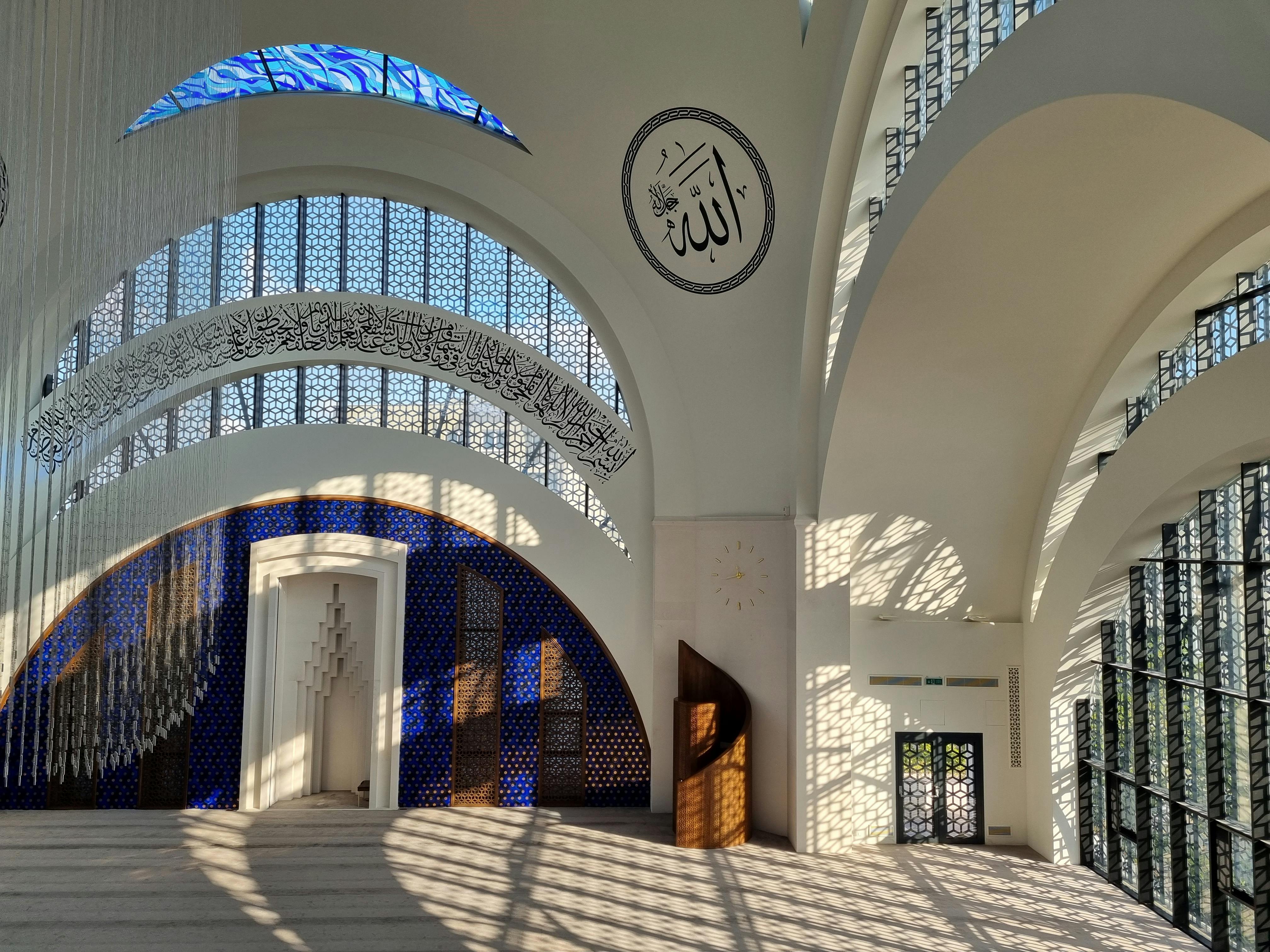 Modern Mosque Interior with Islamic Calligraphy · Free Stock Photo