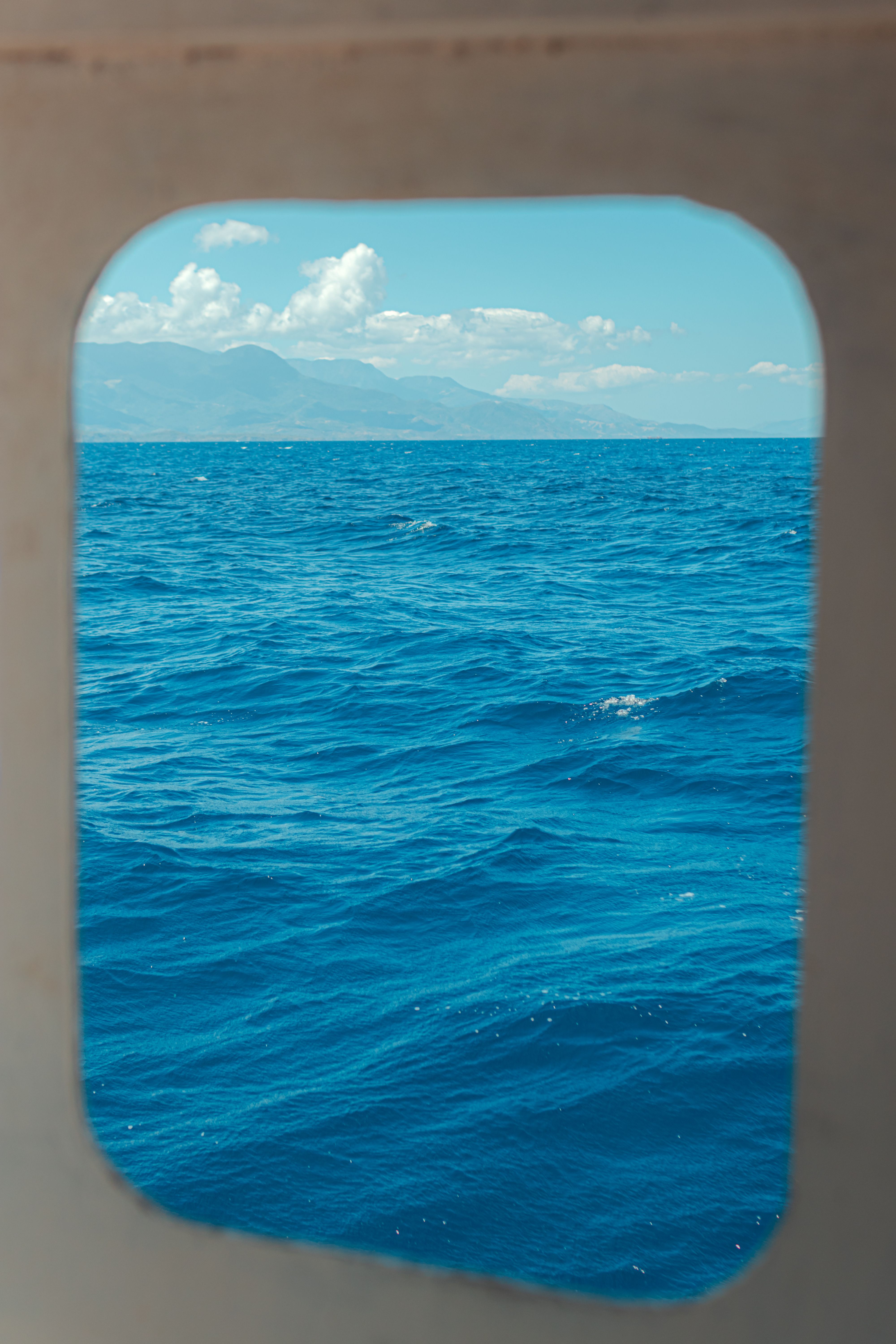 Scenic Ocean View from Boat Window · Free Stock Photo