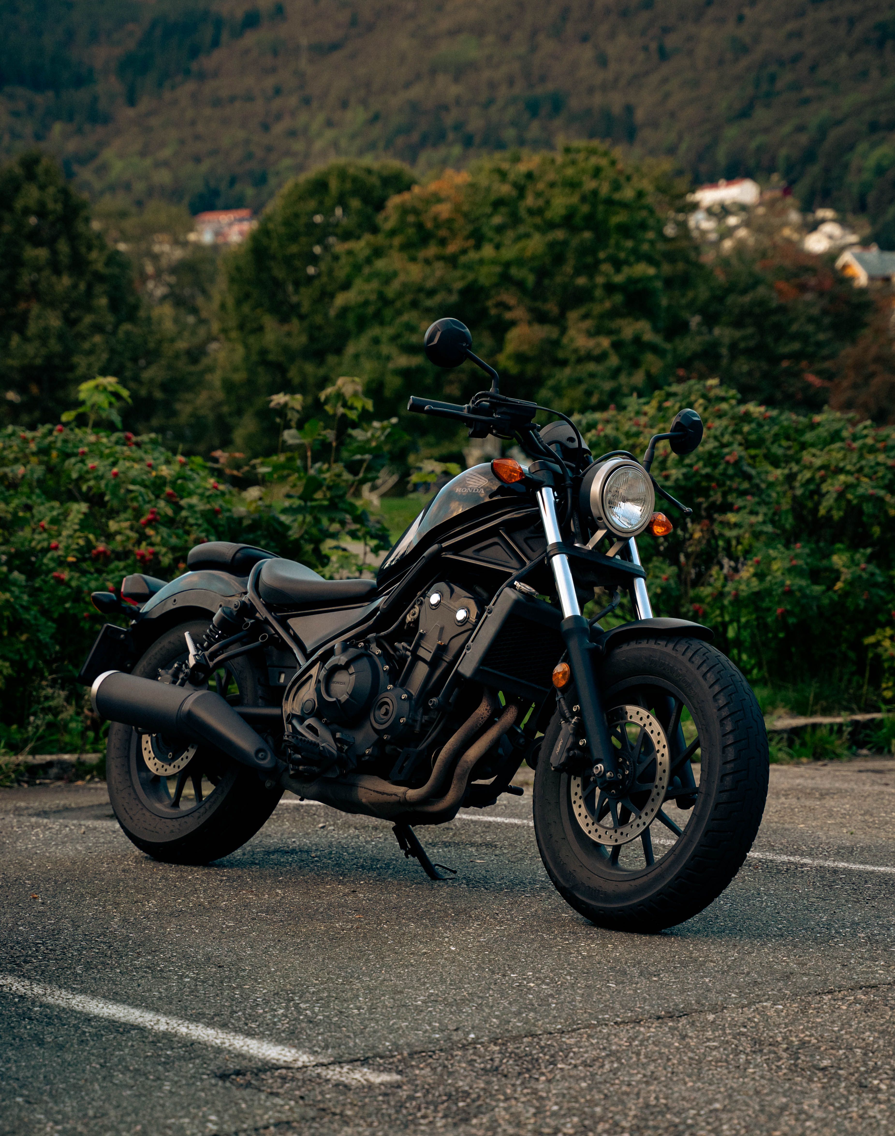 Sleek Motorcycle Parked Outdoors in Scenic Area · Free Stock Photo