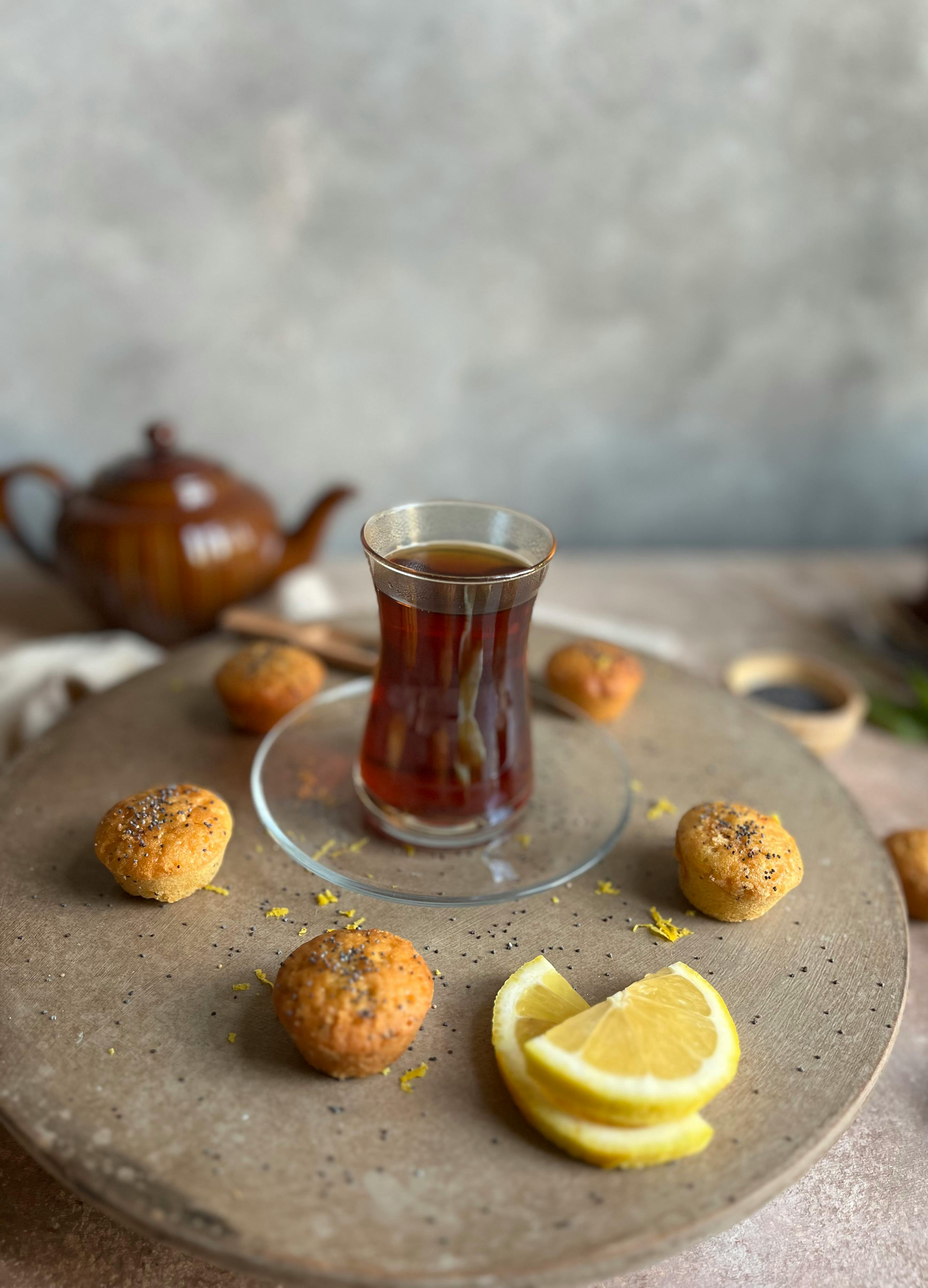 Elegant Tea Presentation with Sweets and Lemon · Free Stock Photo