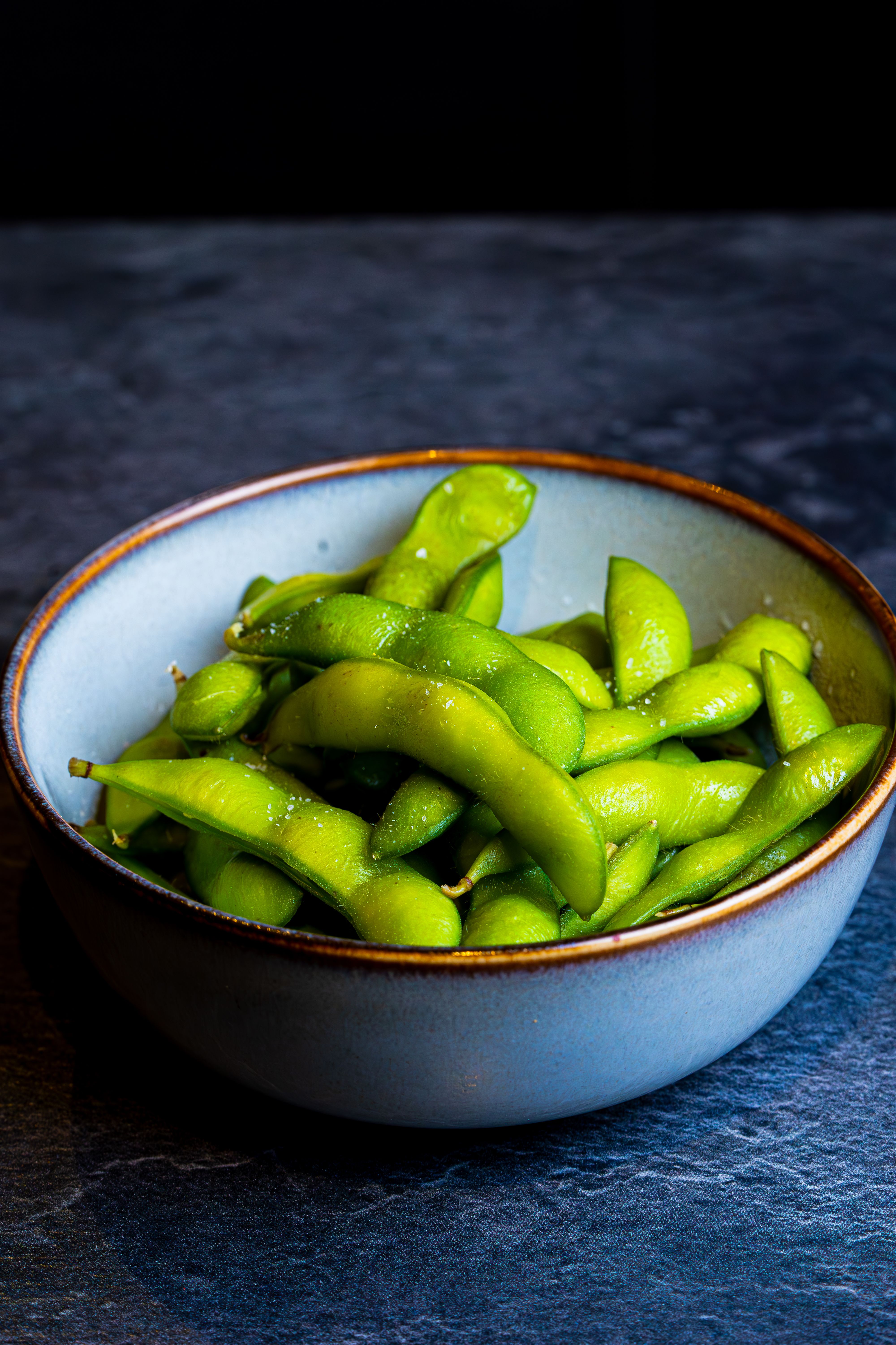 Person Pouring Seasoning on Green Beans on Bowl · Free Stock Photo
