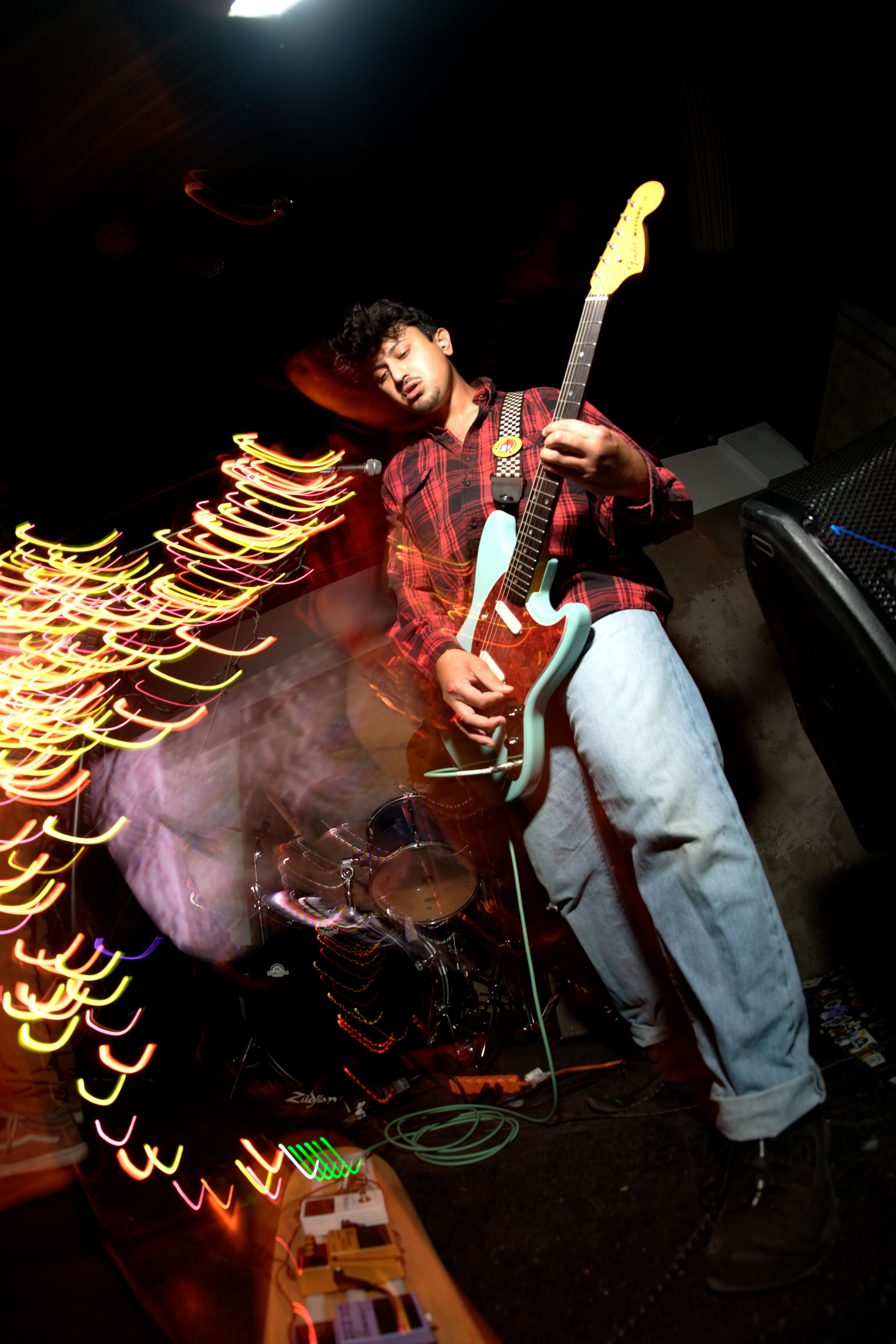 Energetic Live Band Electric Guitar Performance · Free Stock Photo