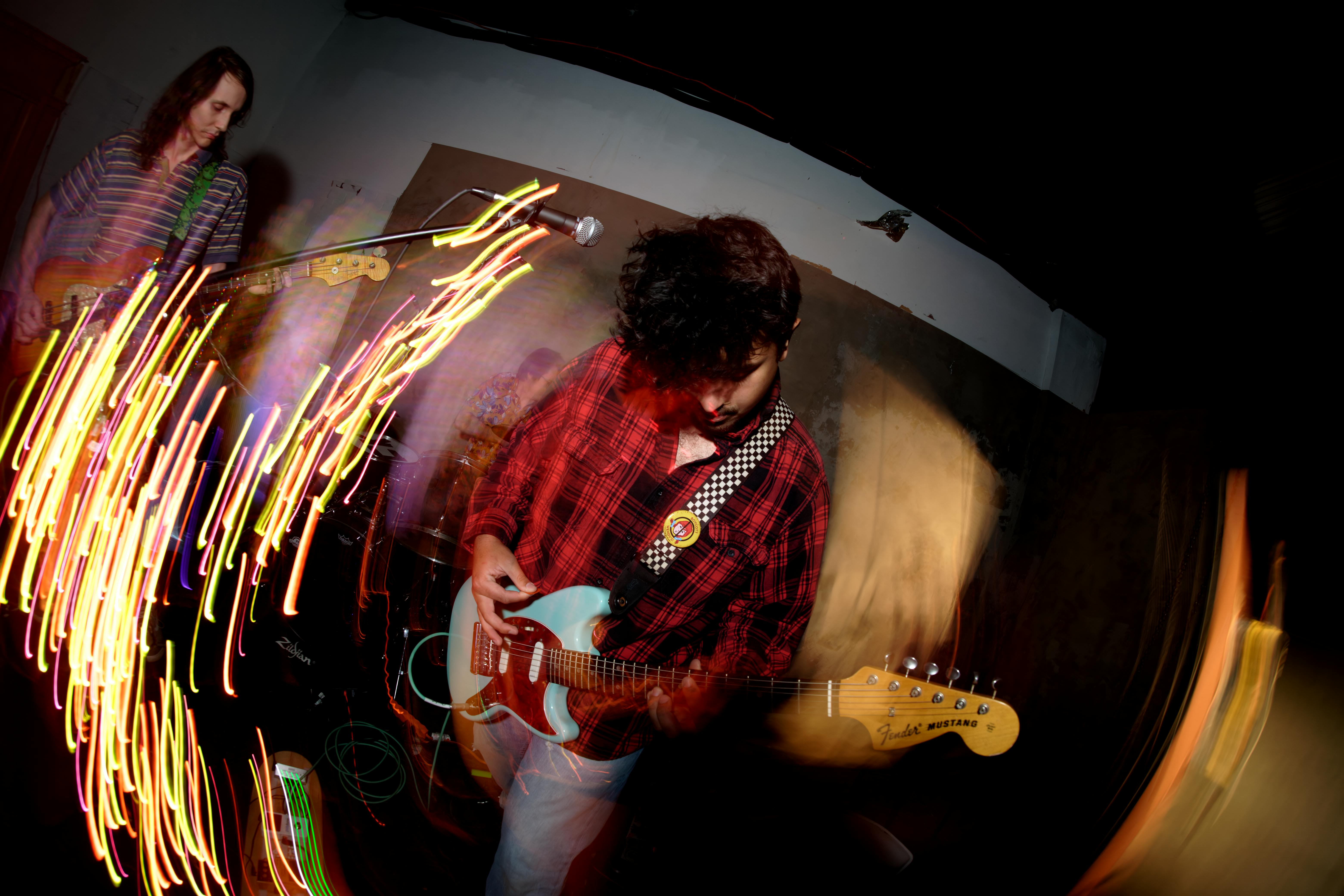 Dynamic Live Band Performance with Electric Guitar · Free Stock Photo