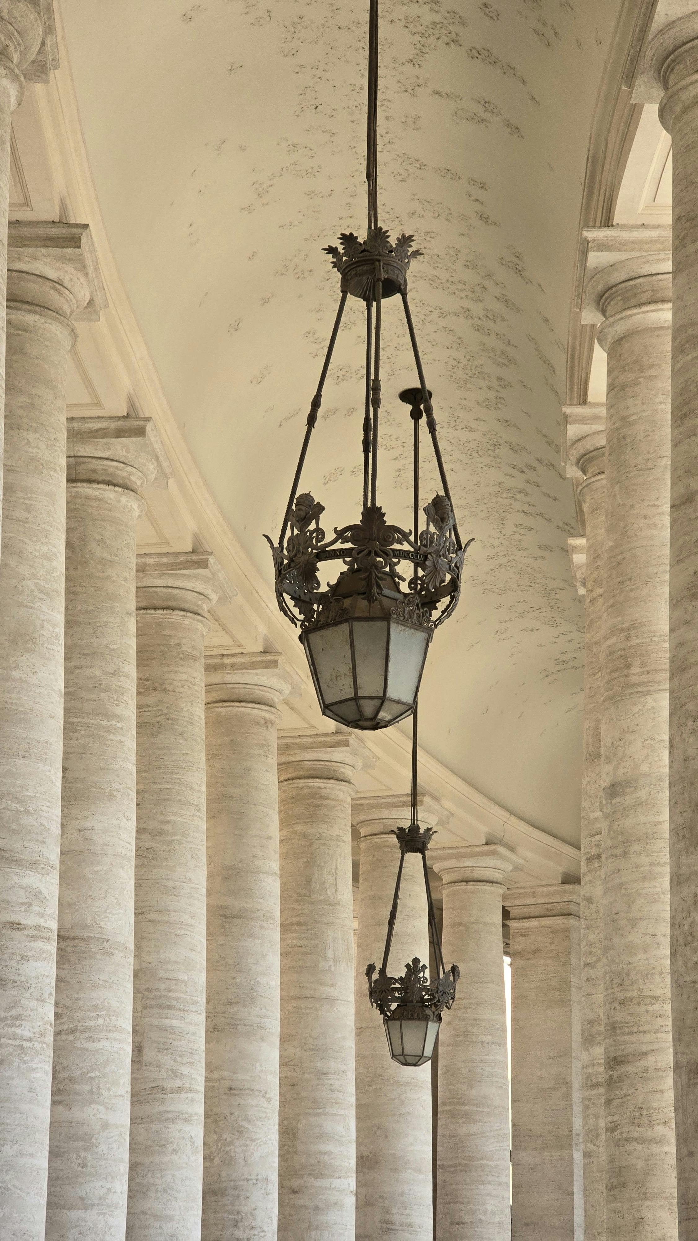 Elegant Stone Columns and Hanging Lanterns · Free Stock Photo