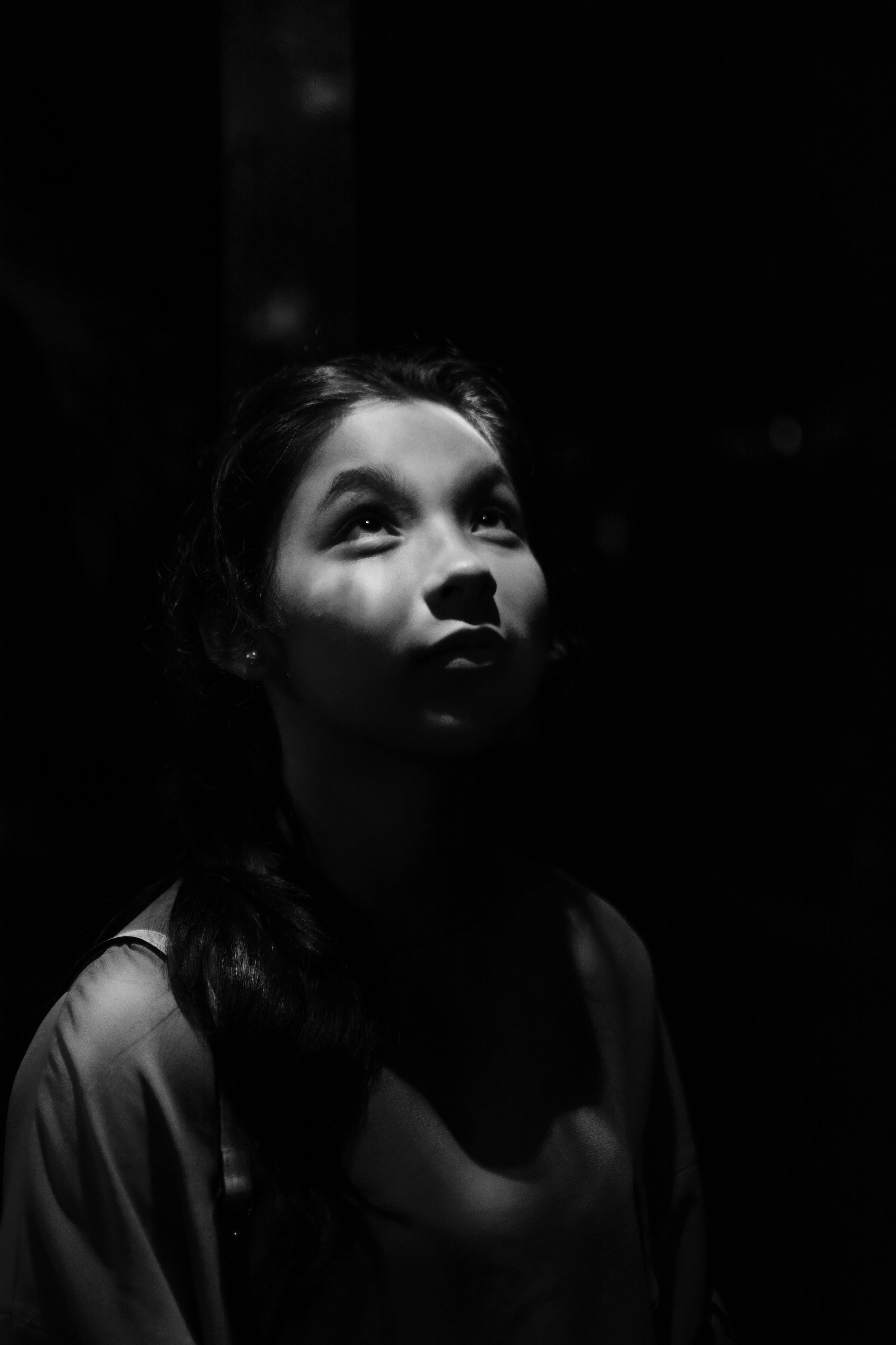 Grayscale Portrait Photo of Woman Looking Up · Free Stock Photo