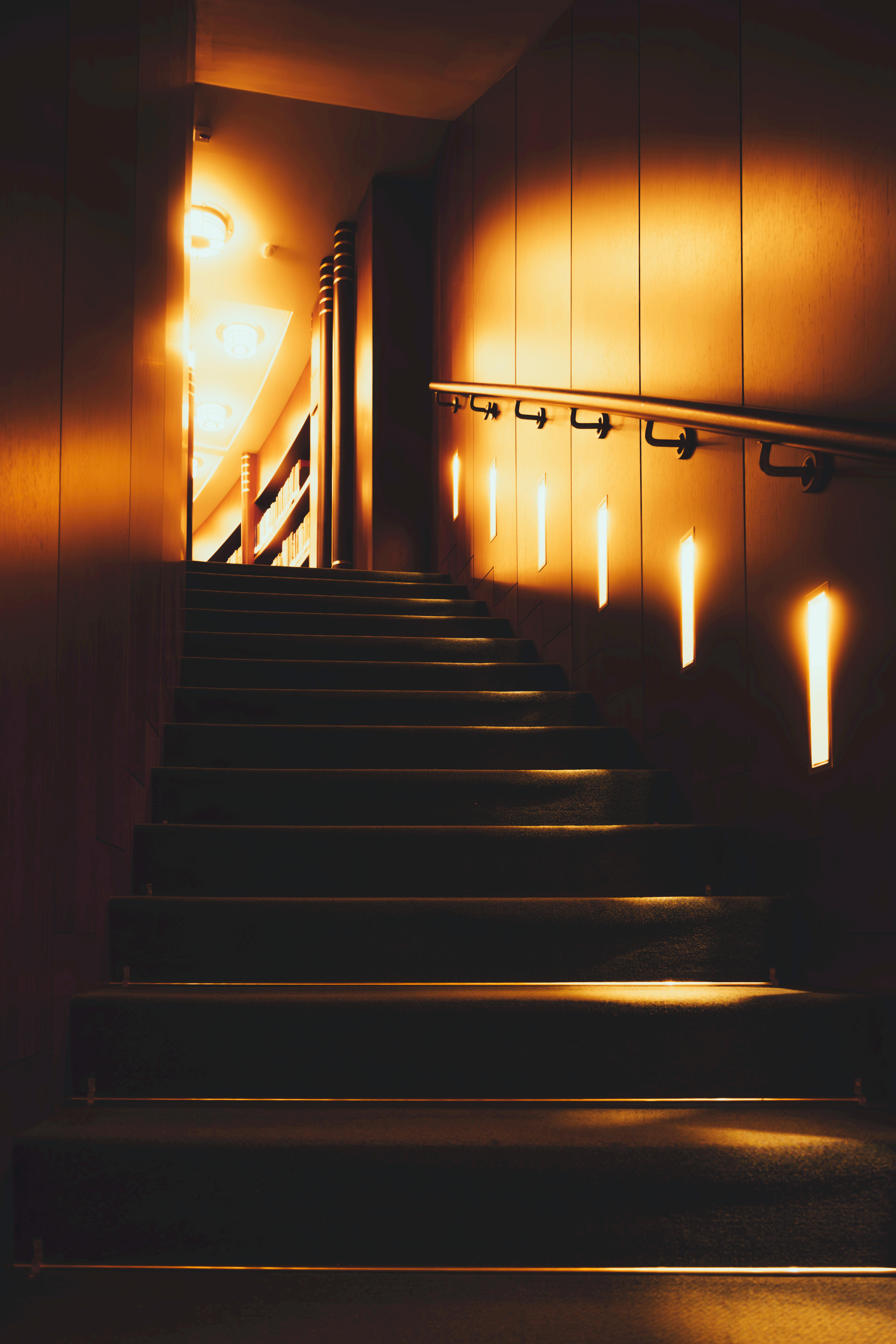 Dimly Lit Staircase with Warm Lighting · Free Stock Photo