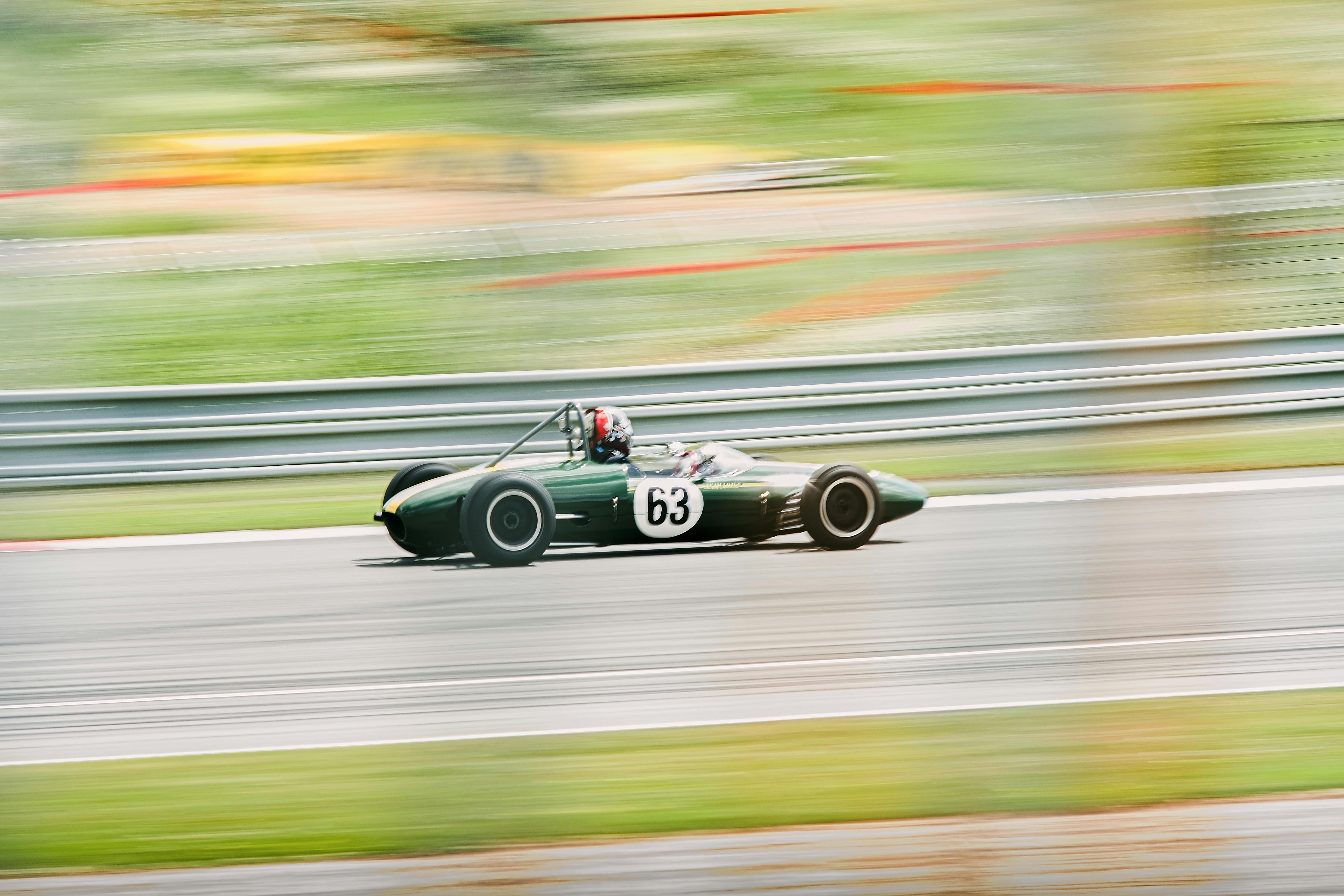 Vintage Race Car Speeding on Track · Free Stock Photo