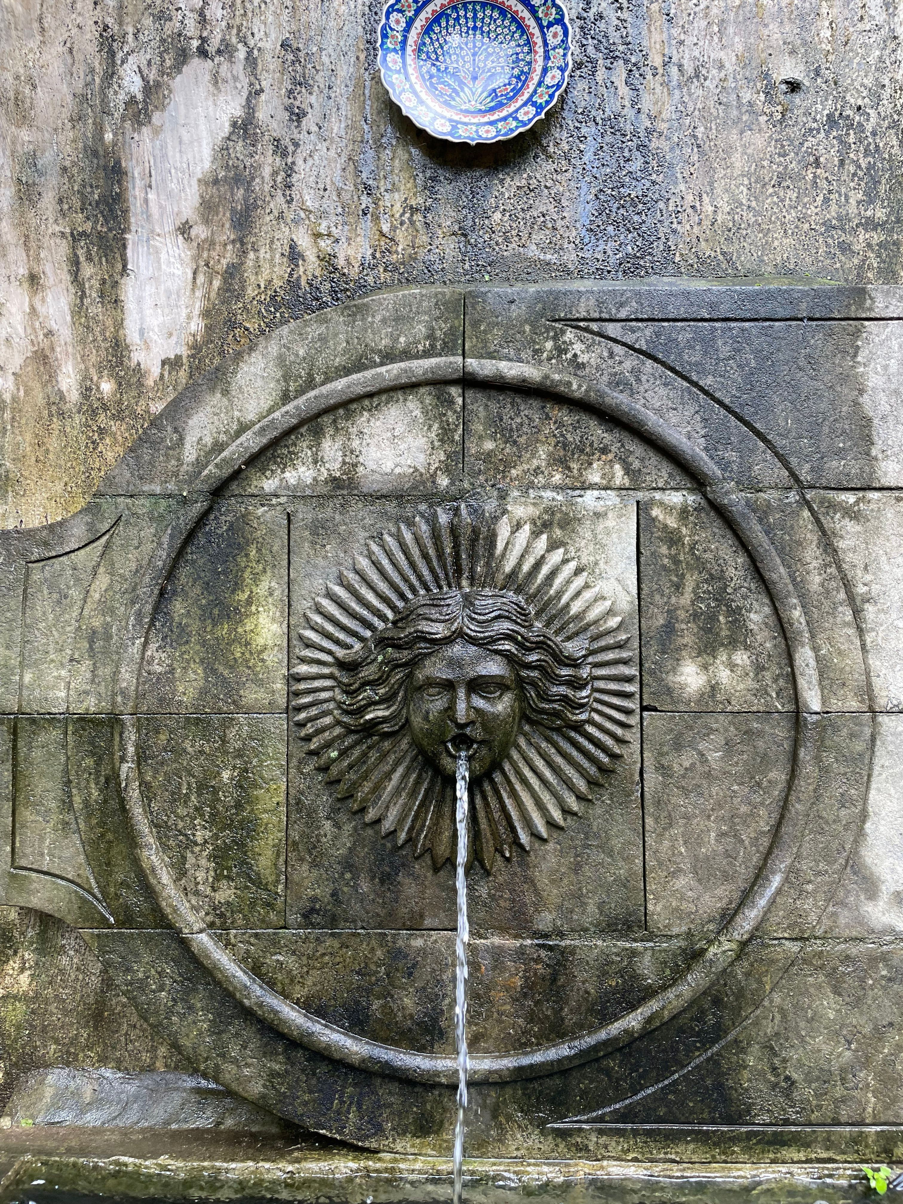 Vintage Stone Fountain with Sculpted Face · Free Stock Photo