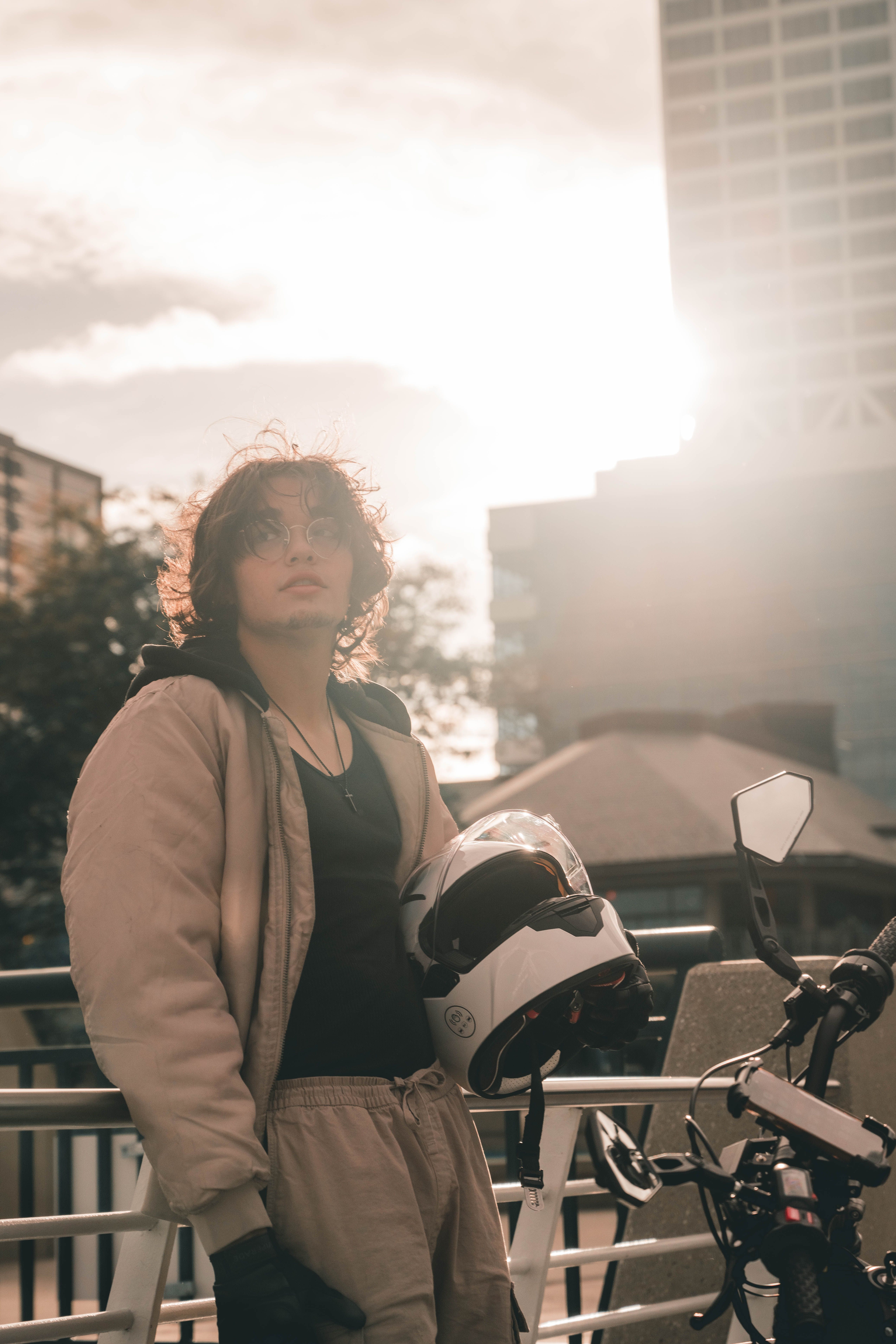 Urban Biker Stands with Motorcycle Helmet in Milwaukee · Free Stock Photo