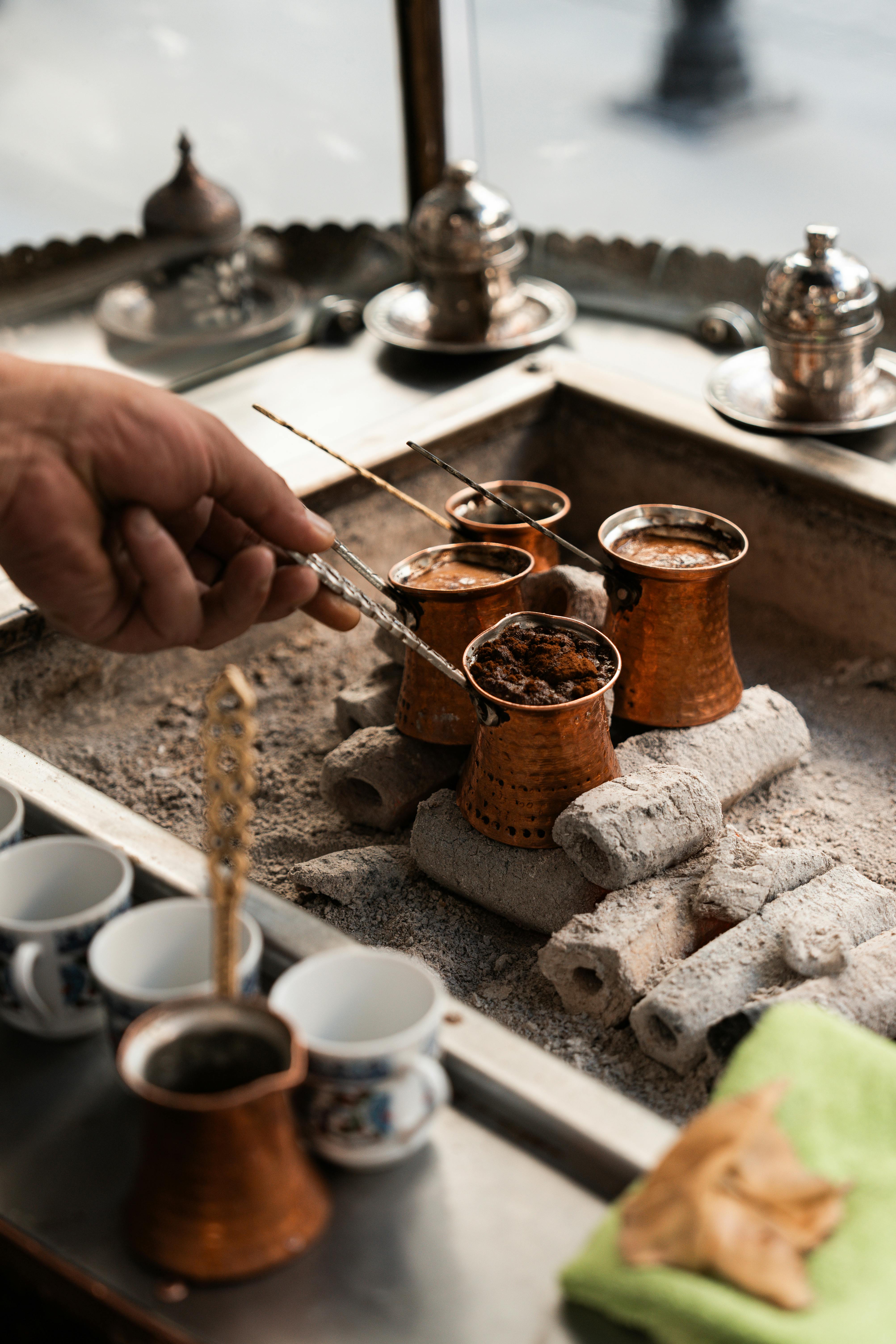 Traditional Turkish Coffee Brewing in Copper Pots · Free Stock Photo