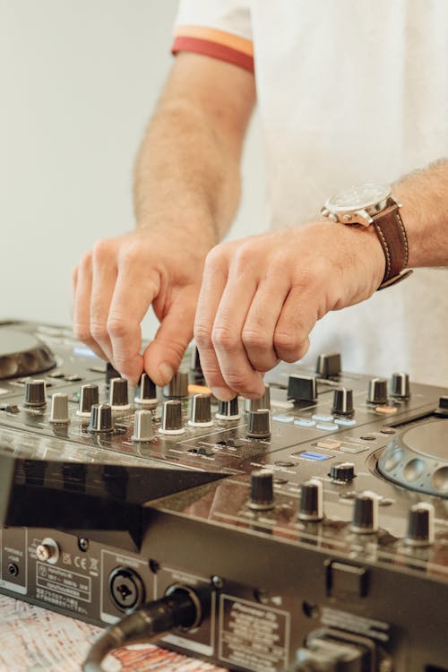 Close-Up of DJ Mixing on a DJ Controller · Free Stock Photo Close-Up of DJ Mixing on a DJ Controller · Free Stock Photo