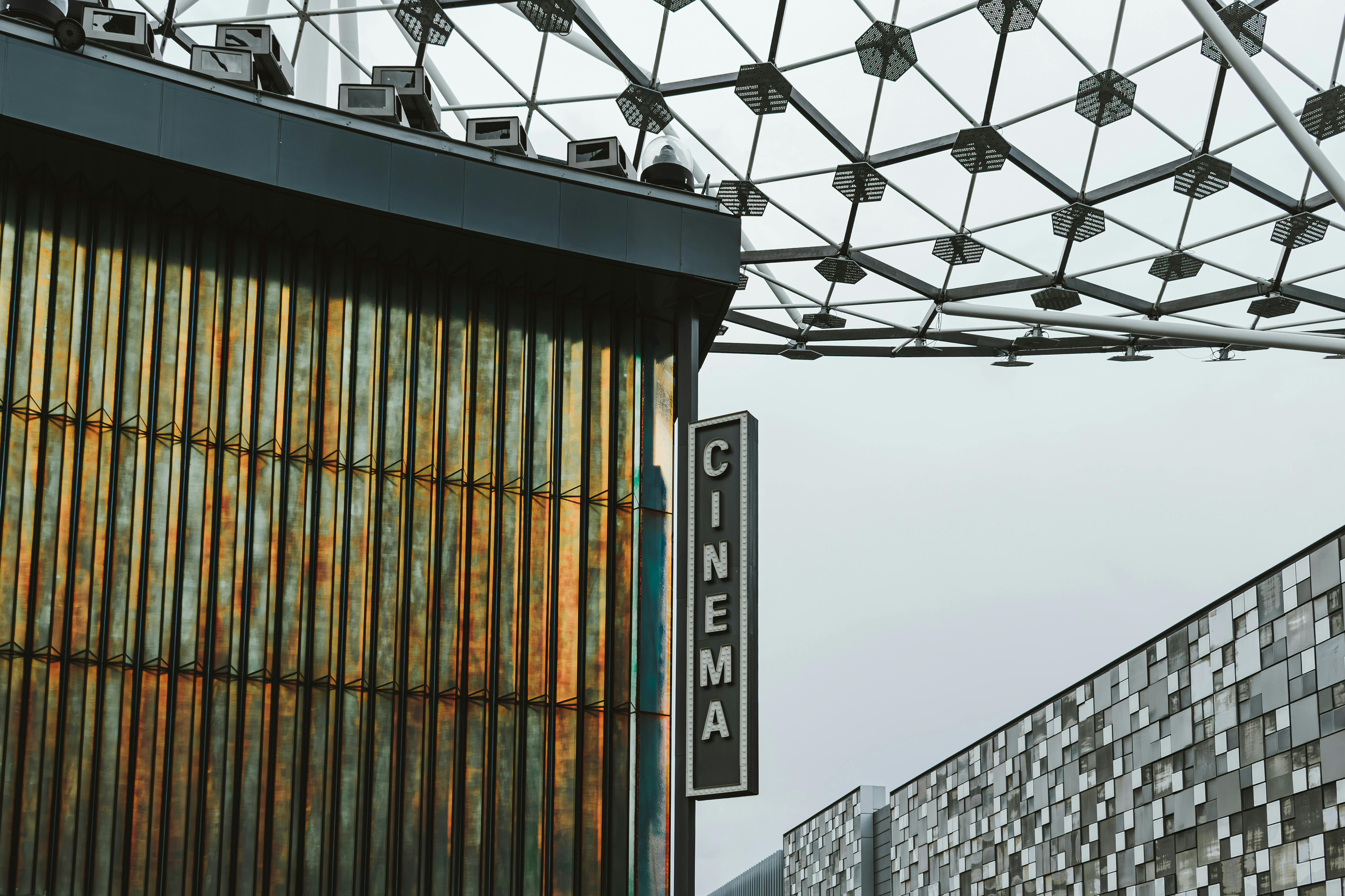 Modern Cinema Exterior with Geometric Architecture · Free Stock Photo