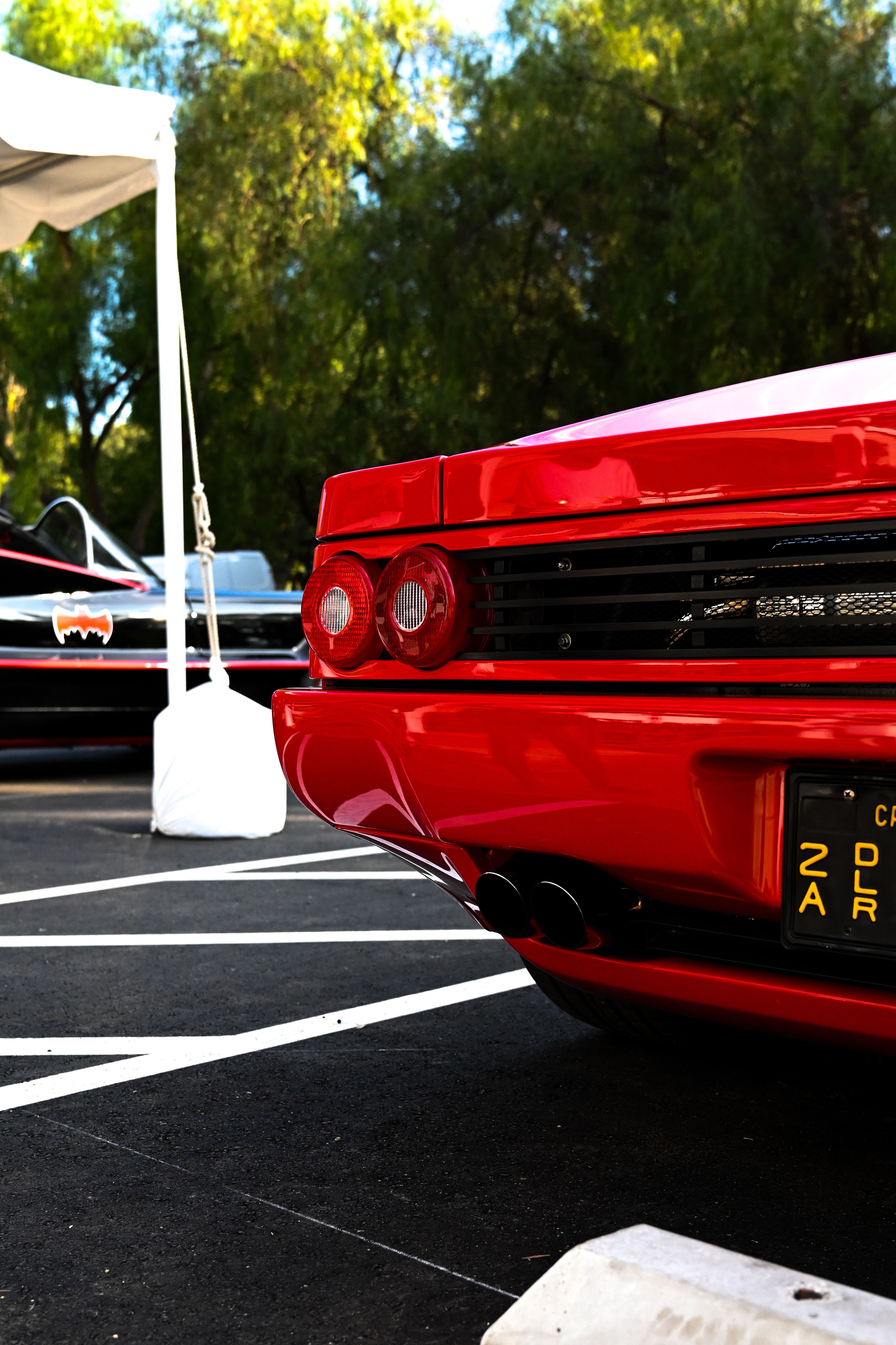 Classic Red Sports Car in Outdoor Parking Lot · Free Stock Photo