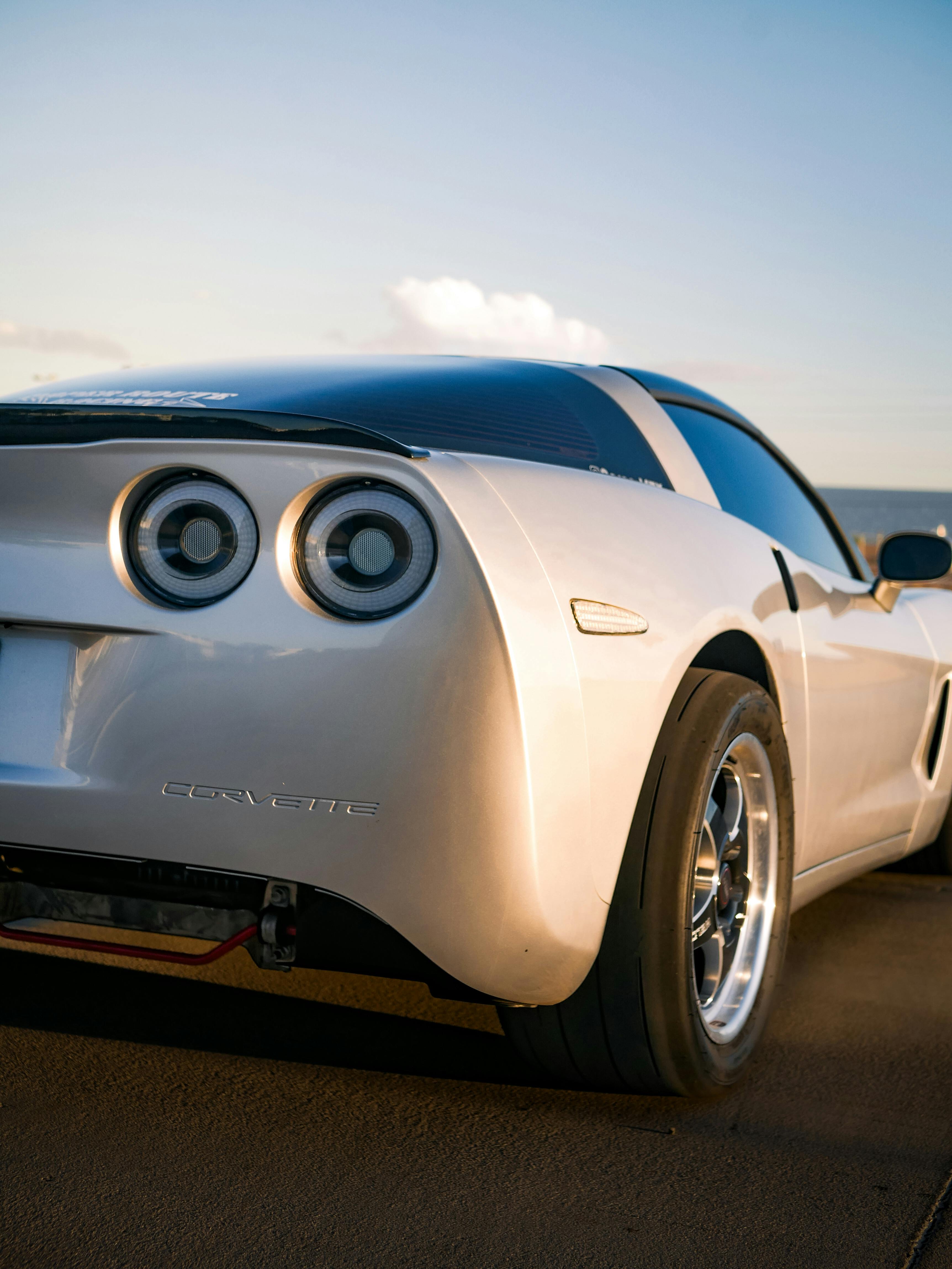 Rear View of Sports Car at Golden Hour · Free Stock Photo