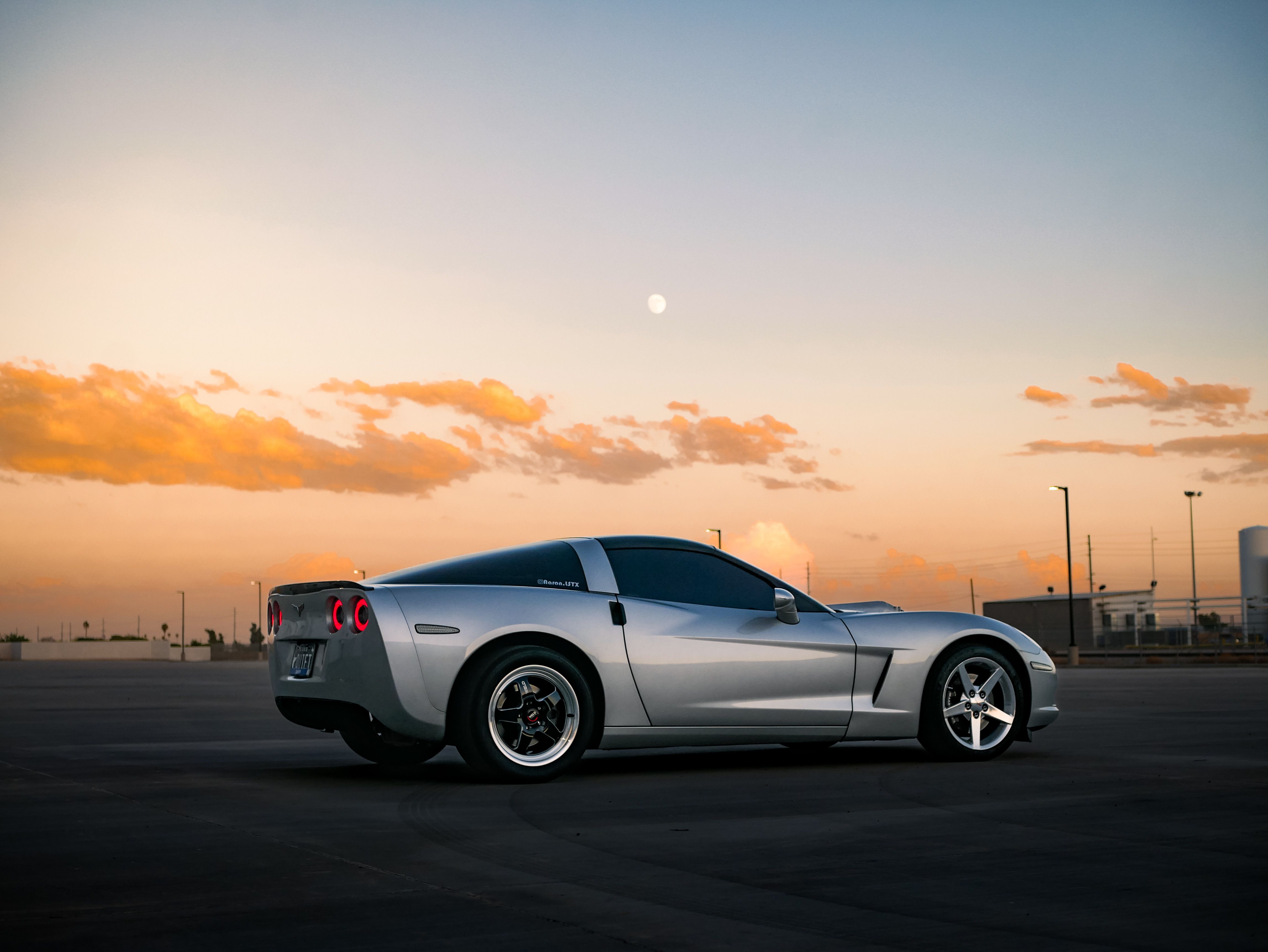 Sleek Silver Sports Car at Sunset · Free Stock Photo