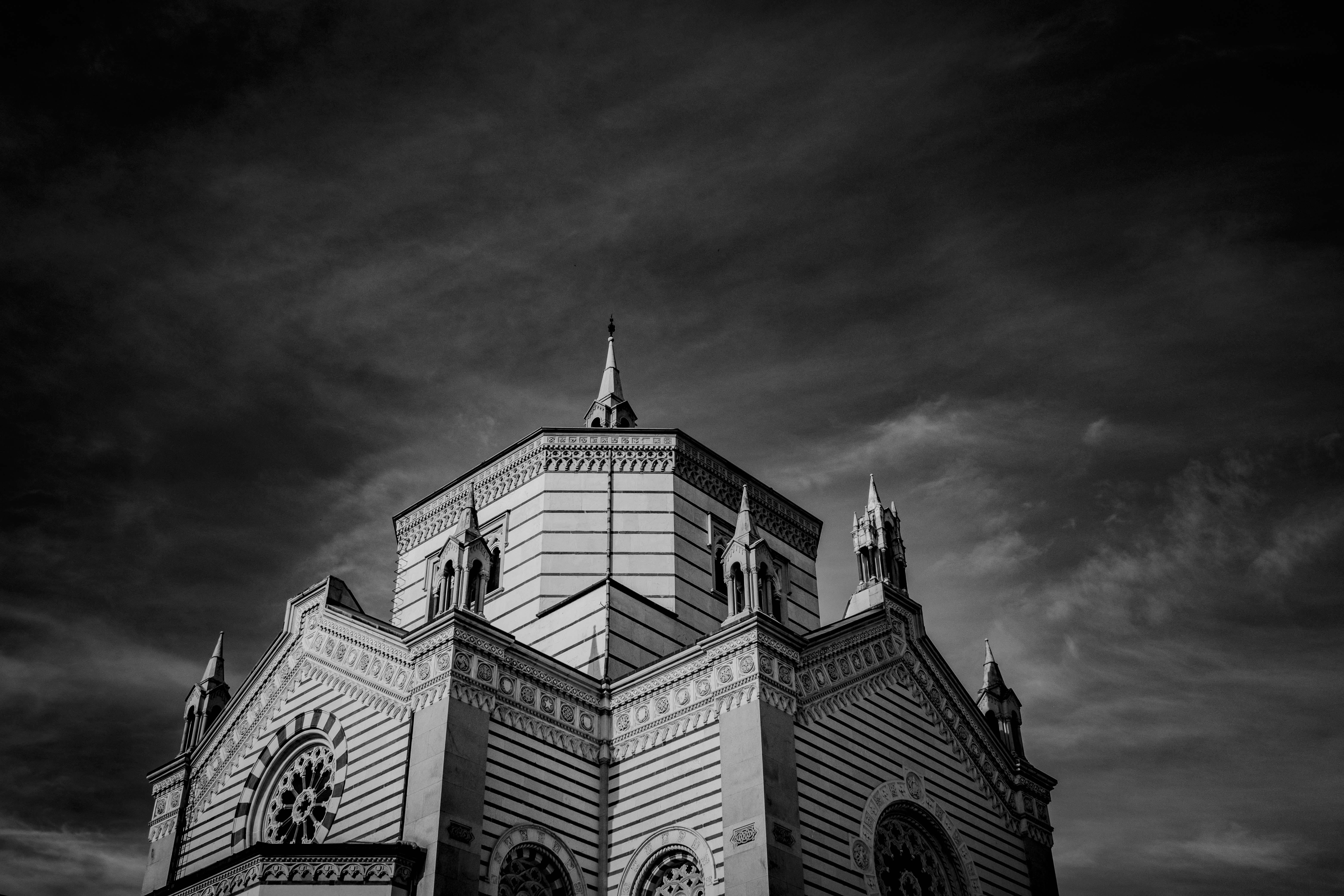 Dramatic Gothic Architecture Against Stormy Skies · Free Stock Photo