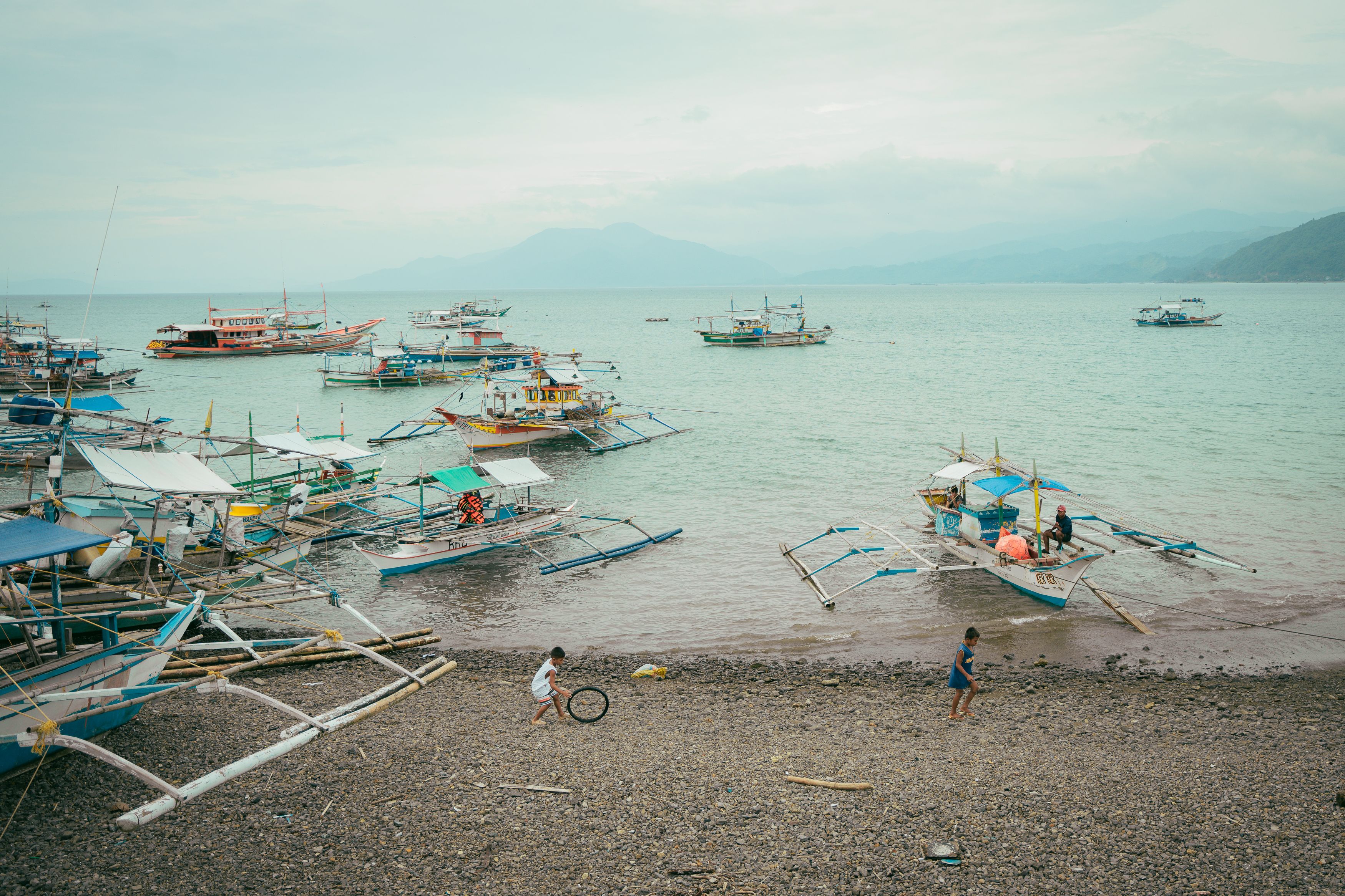 Traditional Fishing Boats on Tropical Shoreline · Free Stock Photo