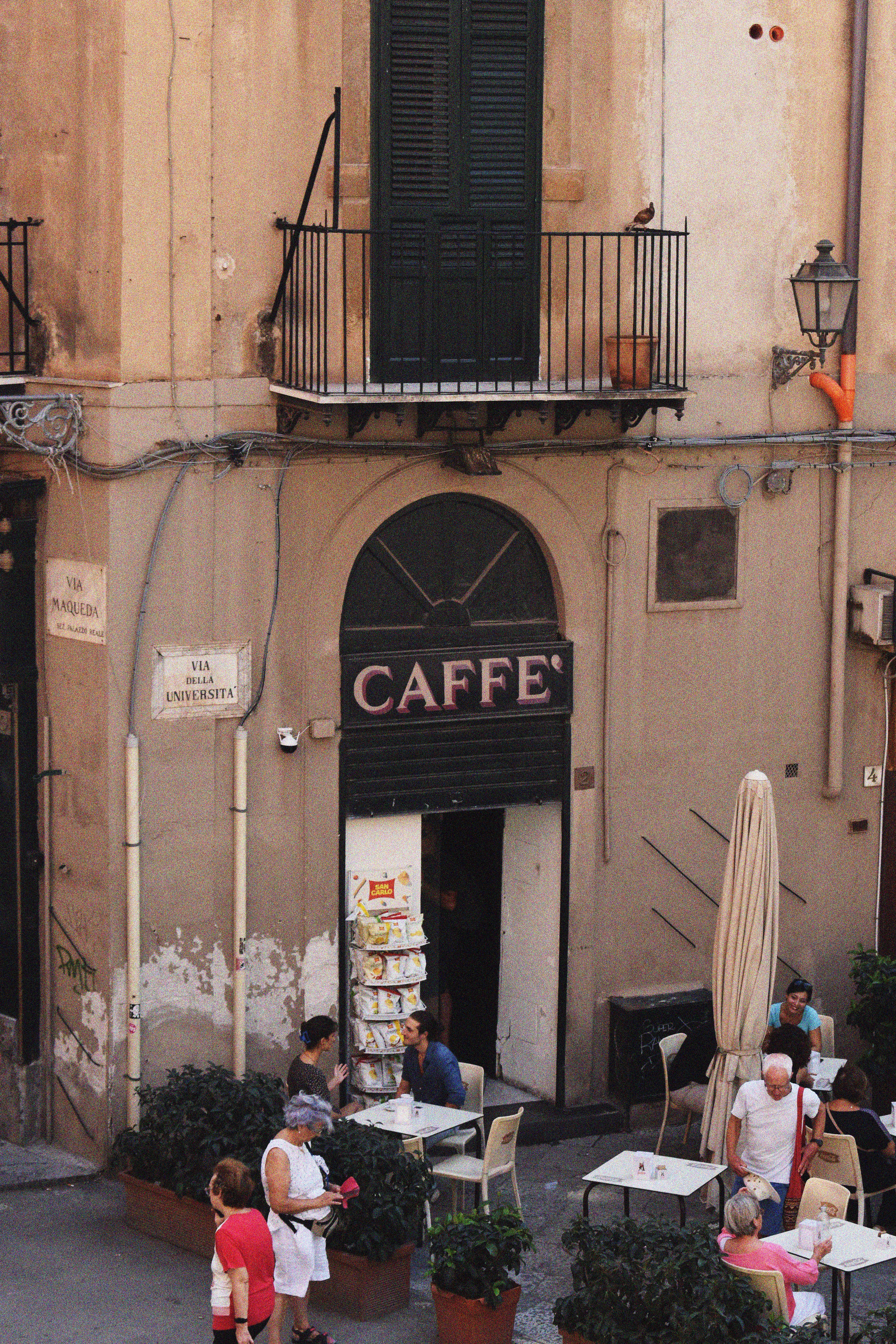 Charming Italian Caffe on a Sunny Street Corner · Free Stock Photo