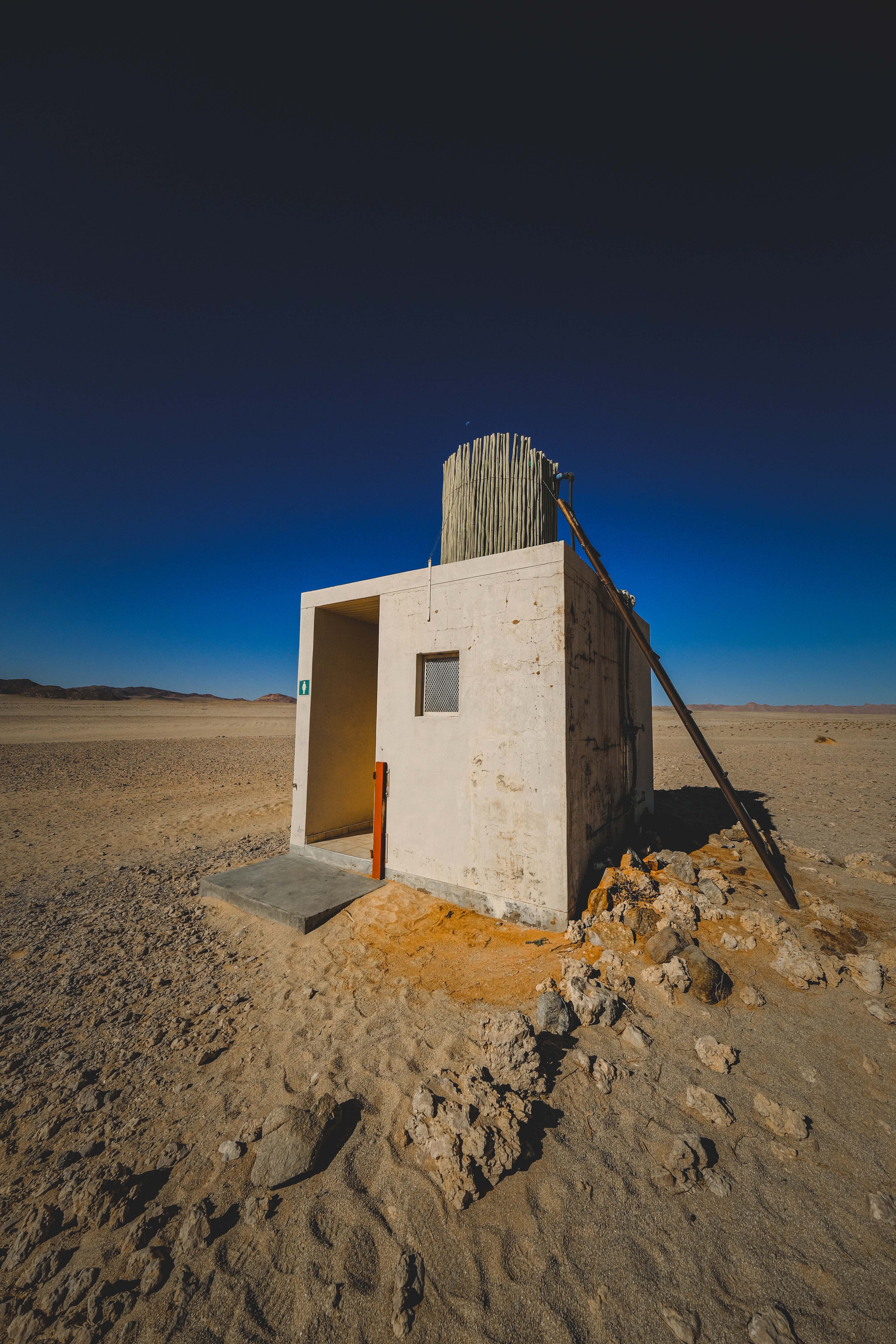 White Concrete Building on Desert · Free Stock Photo