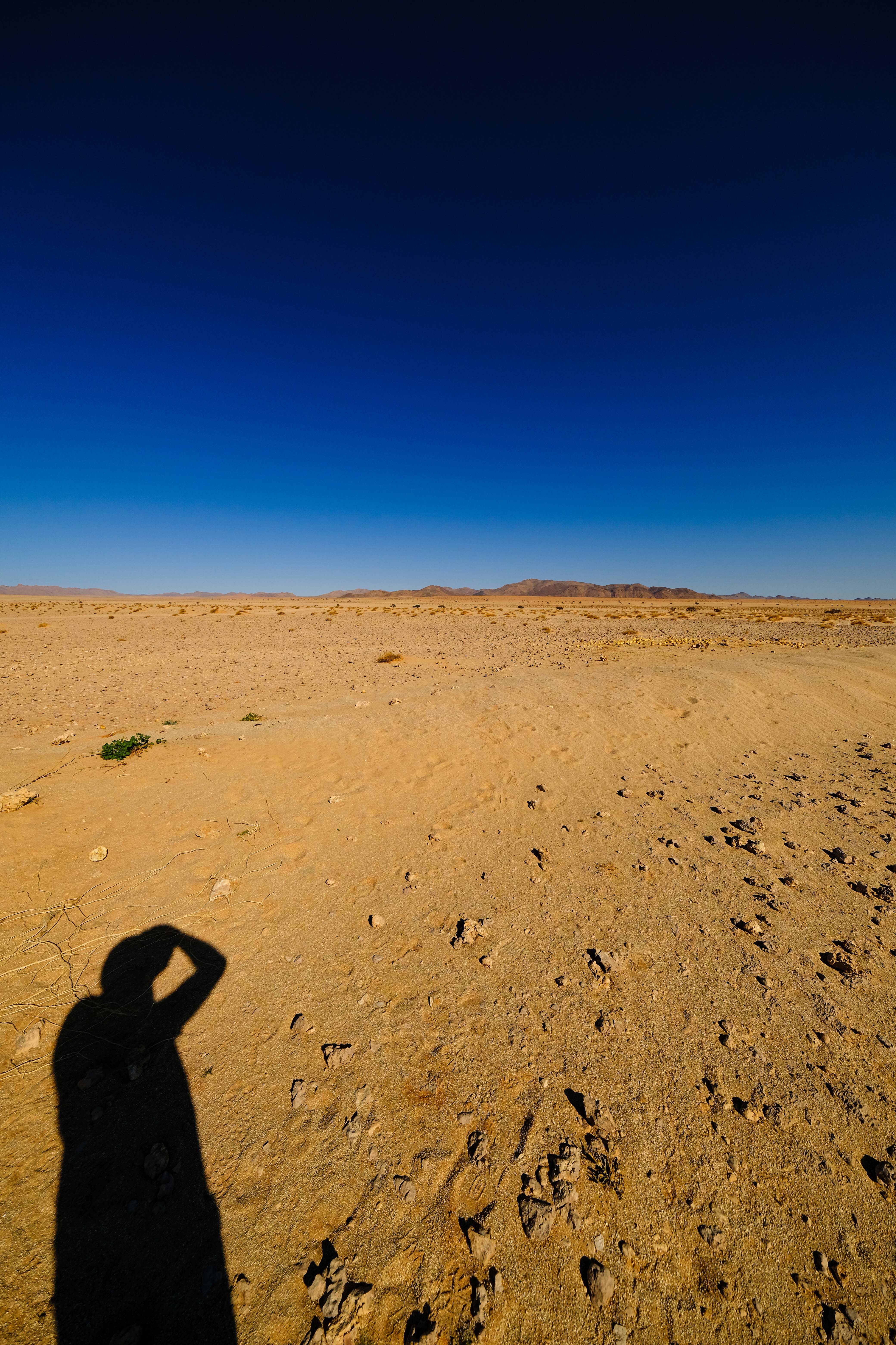 Stunning Desert Landscape with Human Shadow · Free Stock Photo