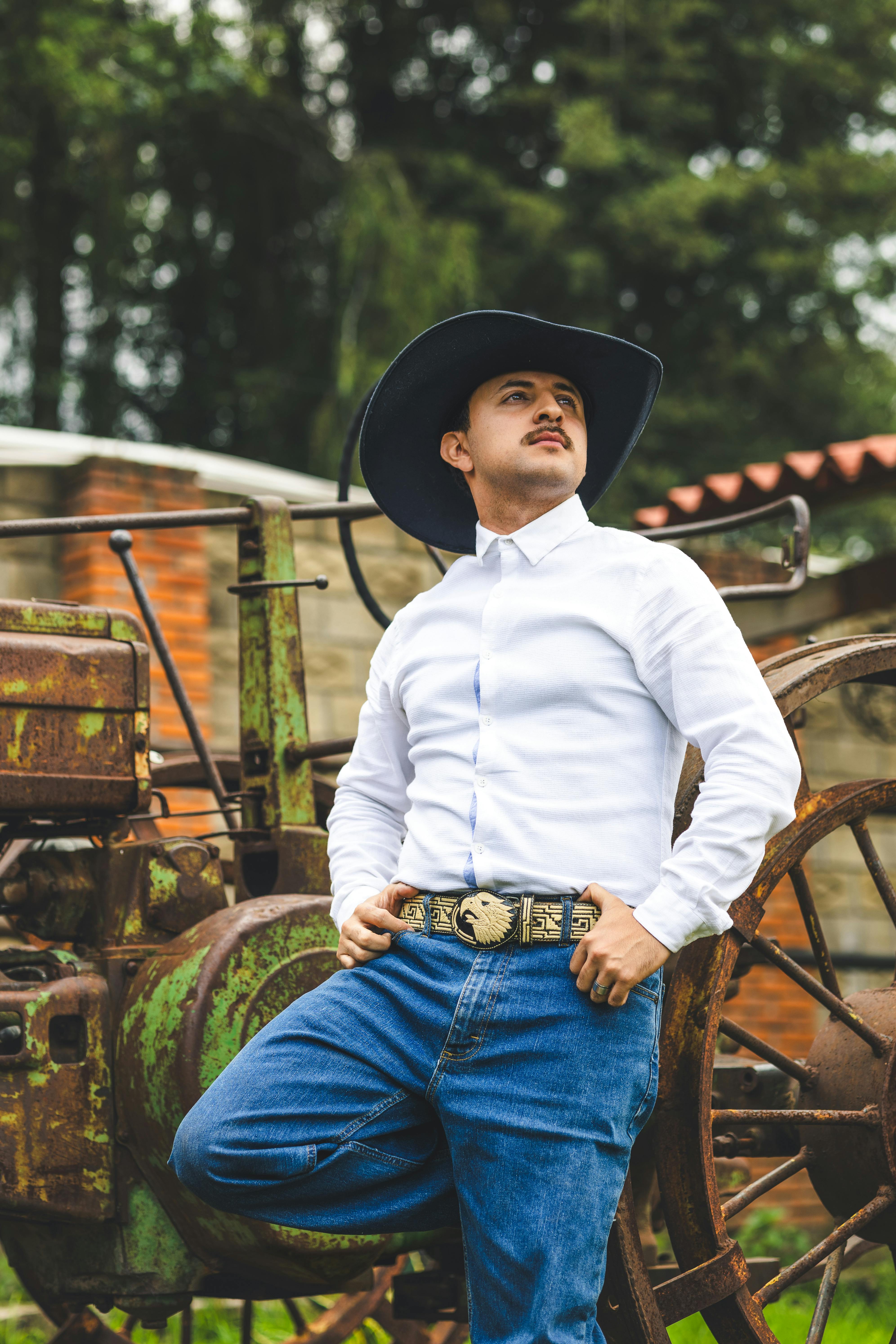 Man in Brown Cowboy Hat Riding A Horse · Free Stock Photo