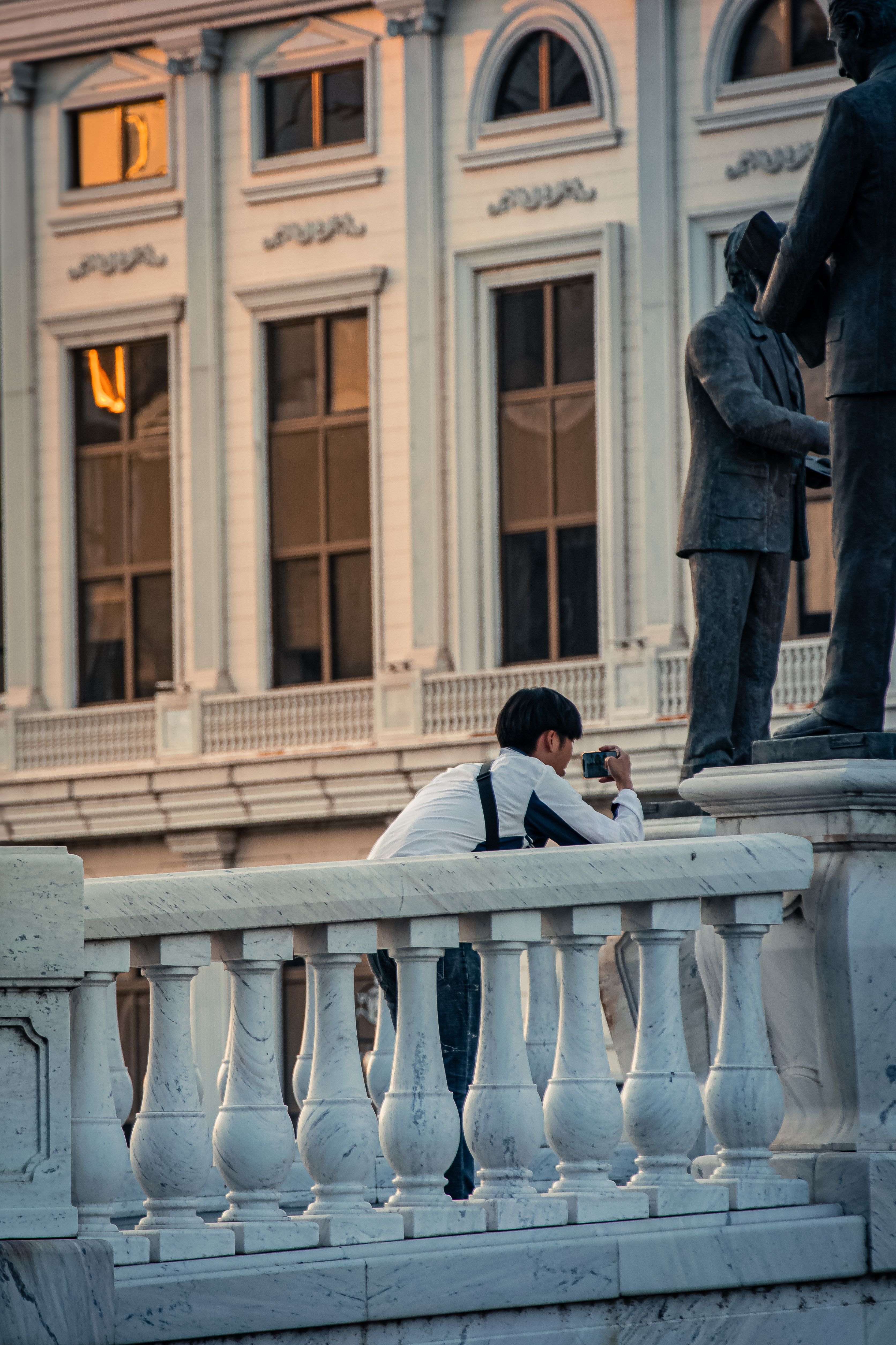 Photographer Capturing Skopje Cityscape at Sunset · Free Stock Photo