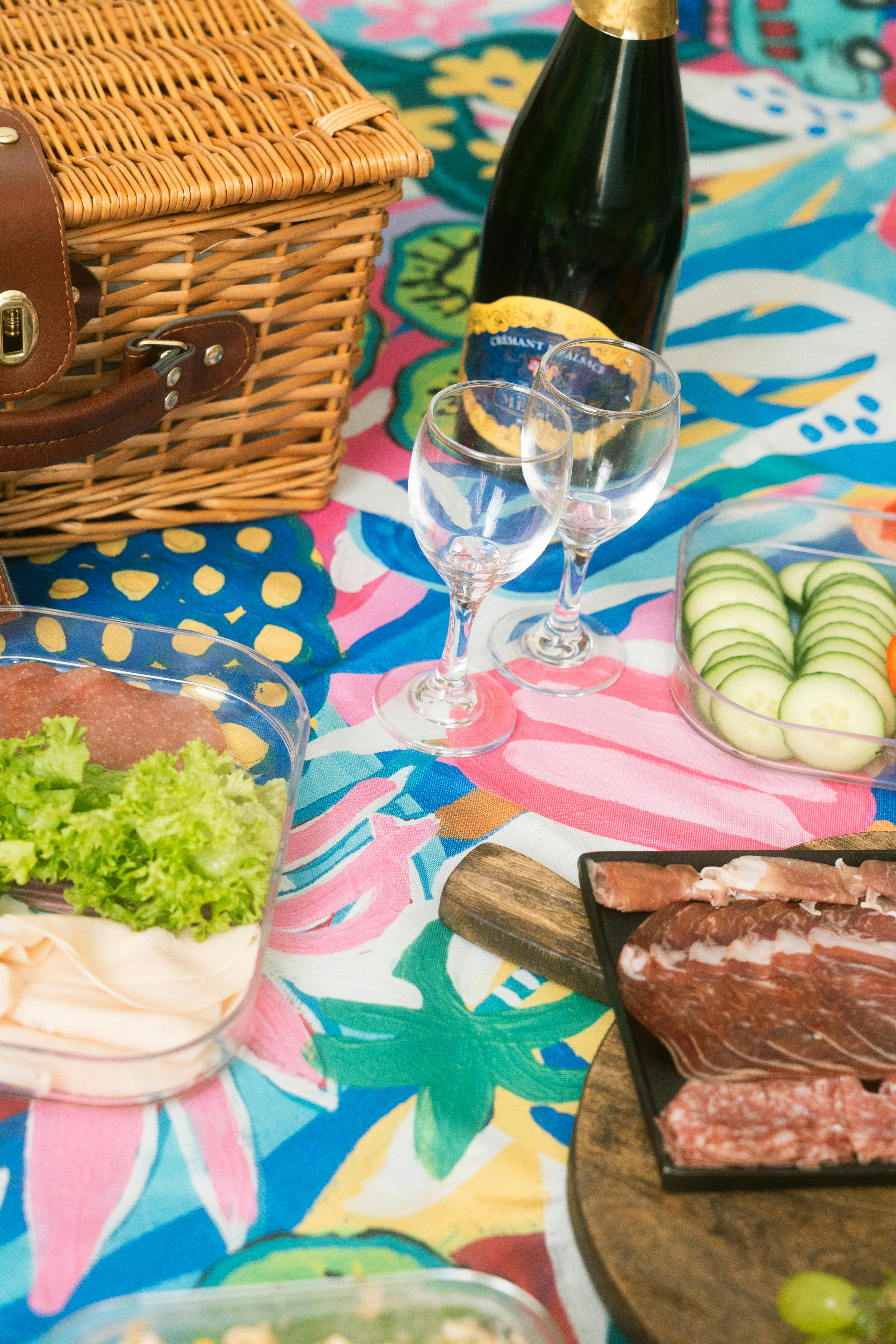 Colorful Picnic Setup with Champagne and Charcuterie · Free Stock Photo