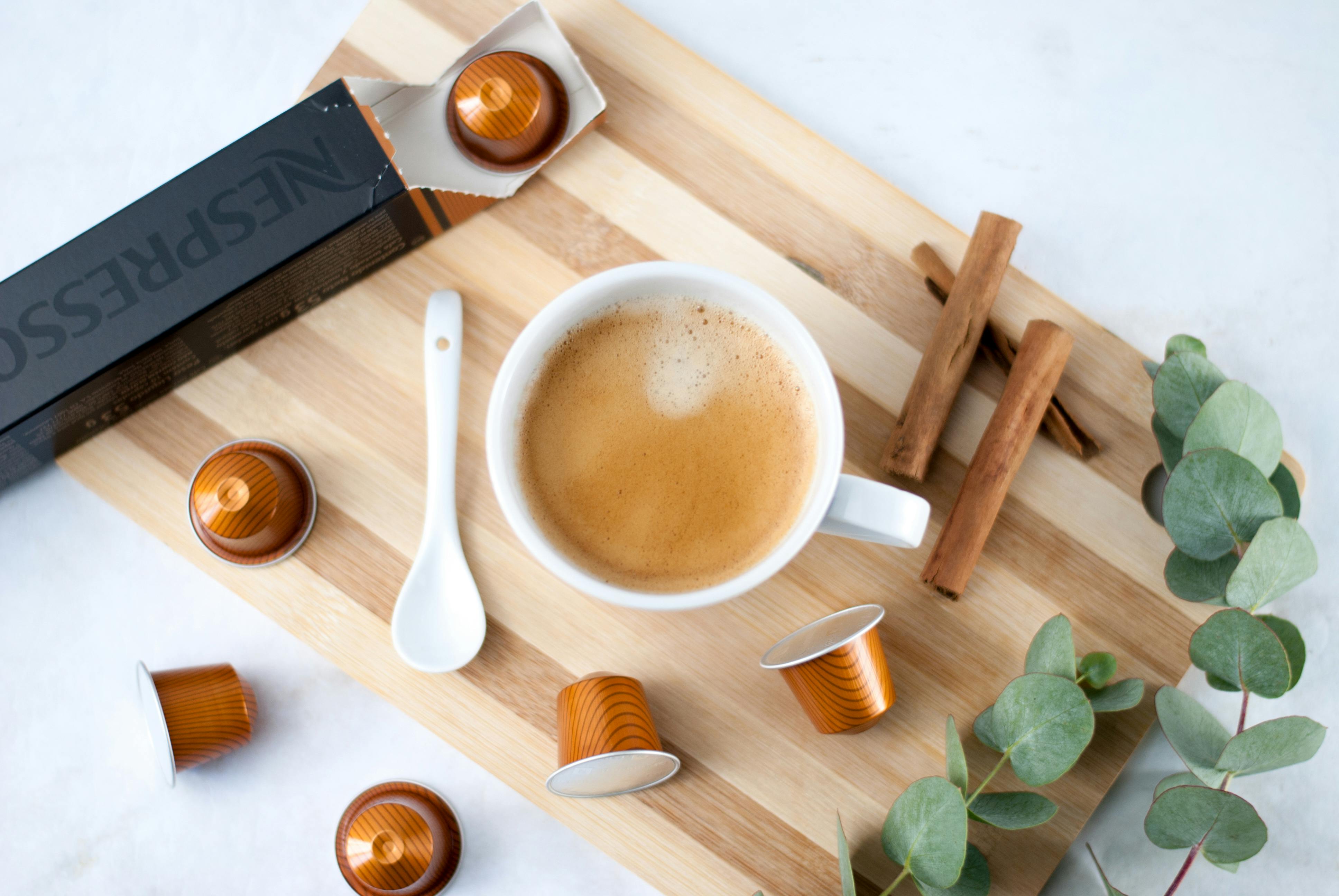 Stylish Coffee Break with Nespresso Capsules · Free Stock Photo