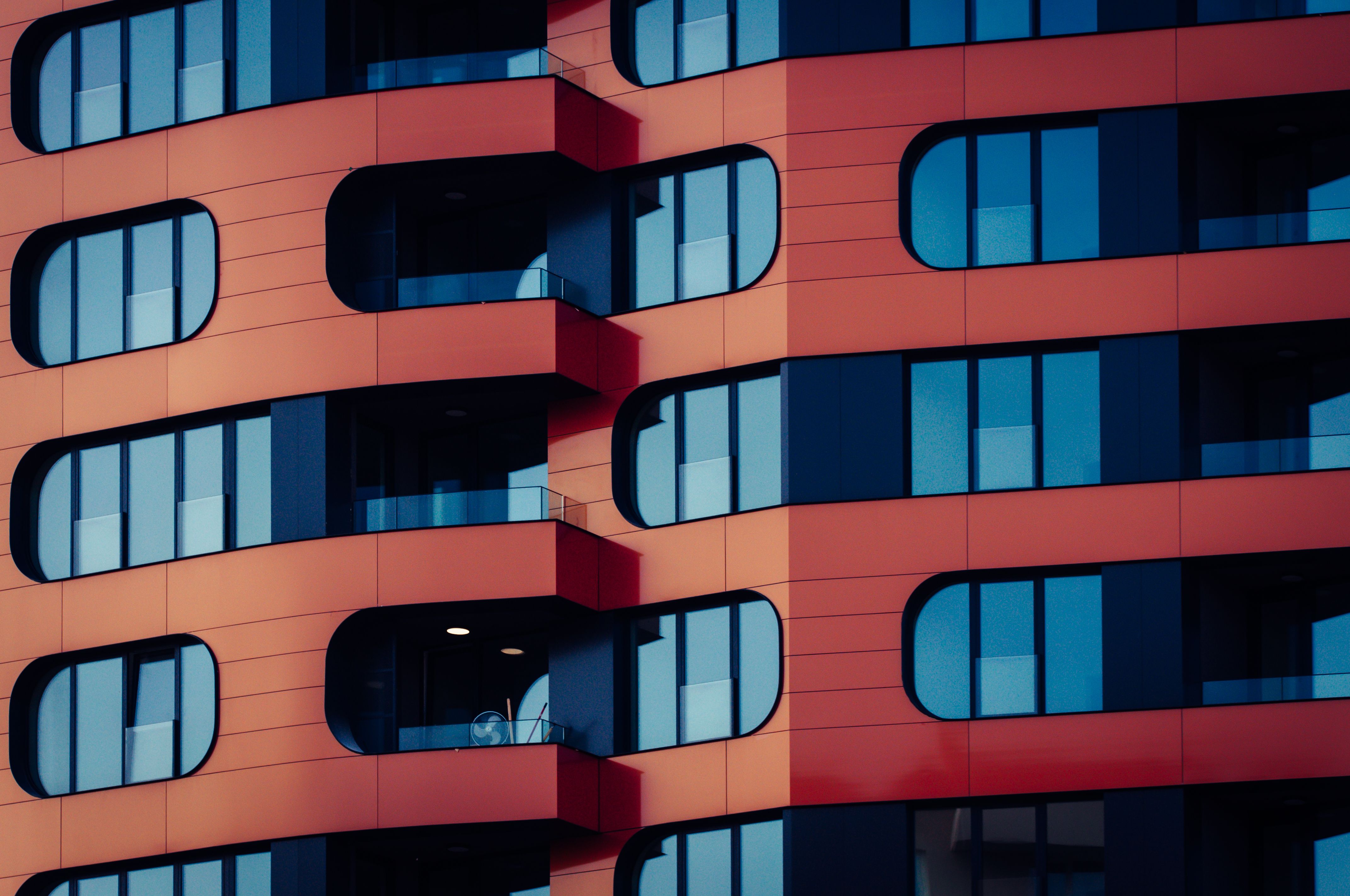 Modern Architectural Facade with Red and Blue Elements · Free Stock Photo