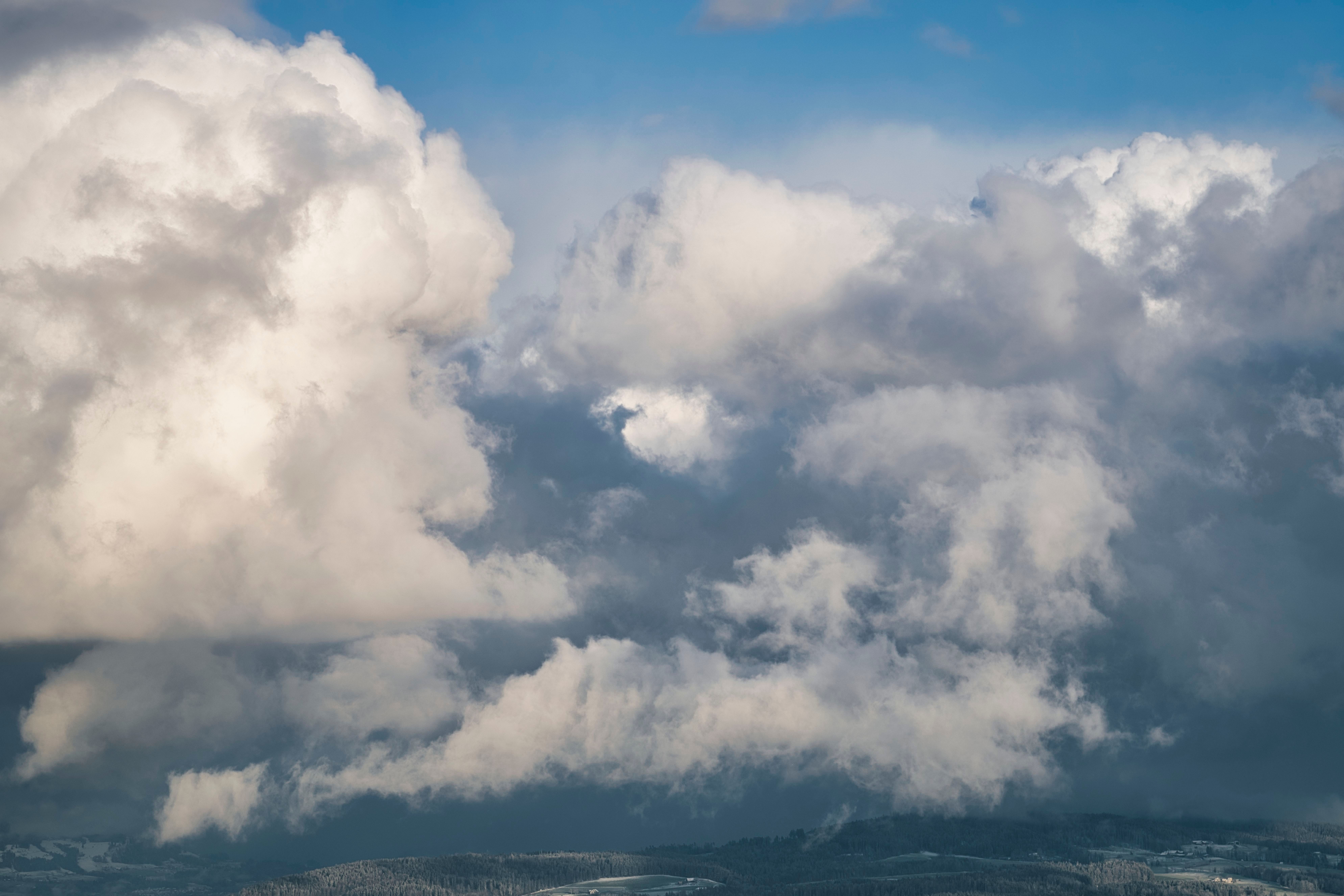 Dramatic Cumulonimbus Clouds Over Landscape · Free Stock Photo