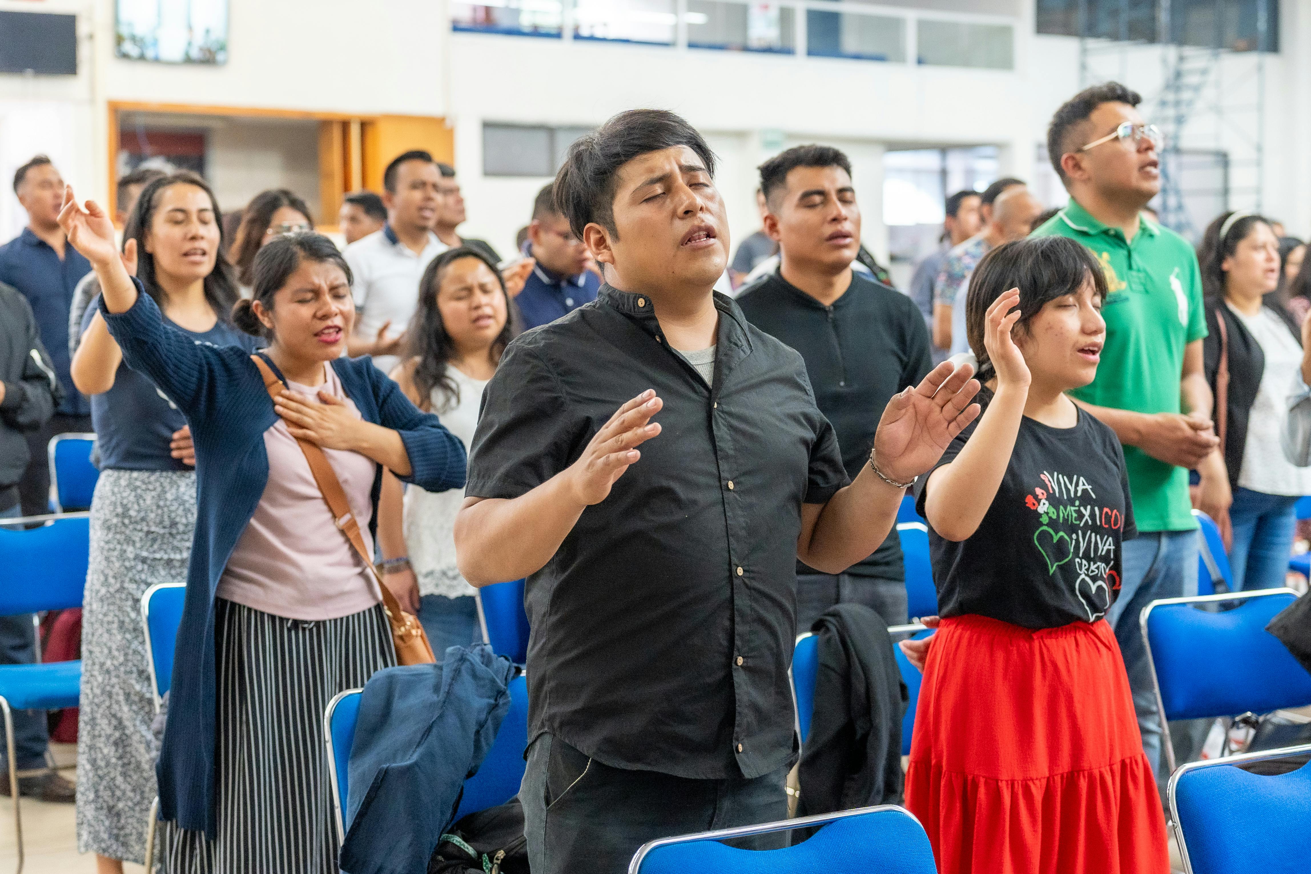 Joyful Church Gathering with Diverse Congregation · Free Stock Photo