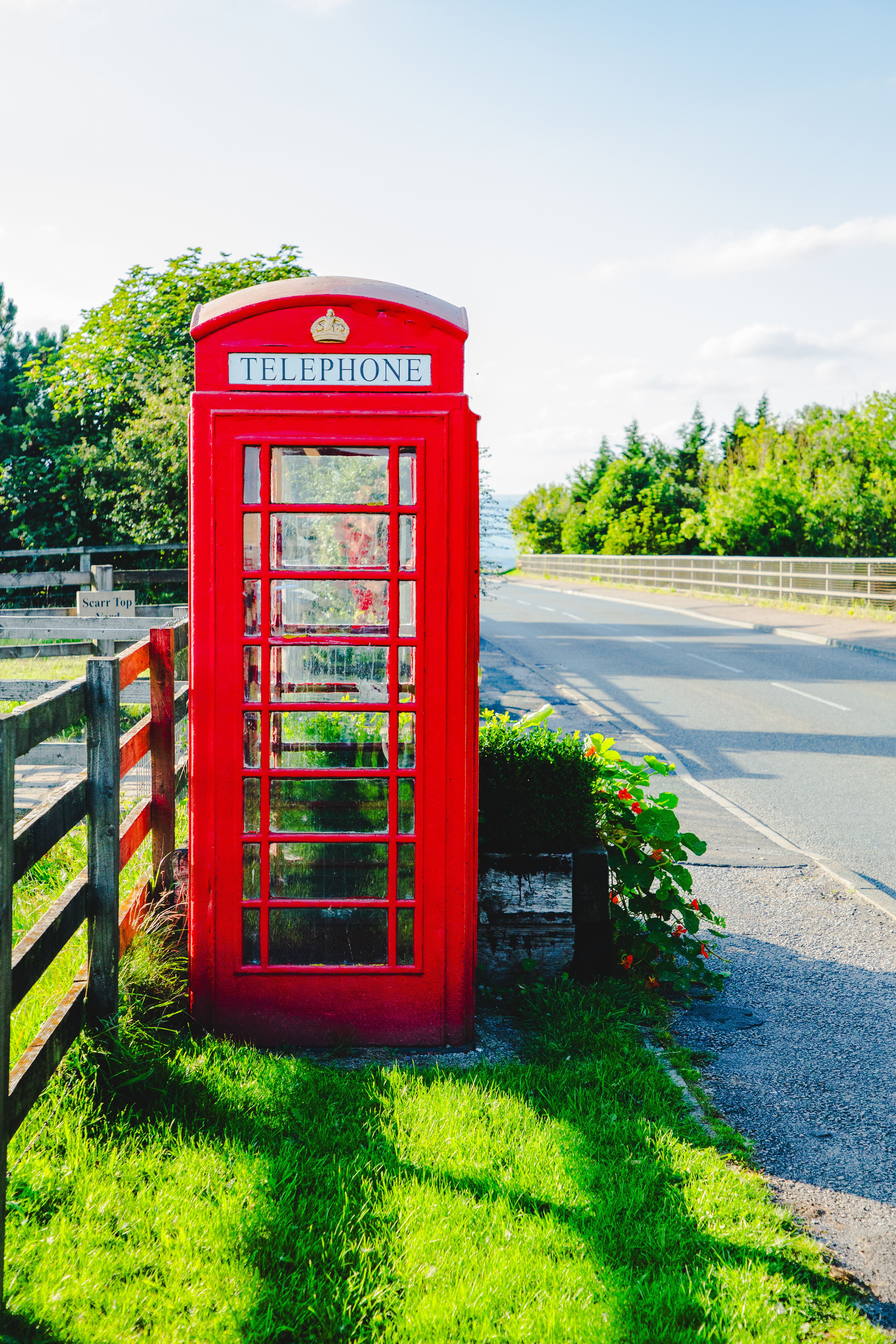 Red Telephone Box by a Sunny Countryside Road · Free Stock Photo