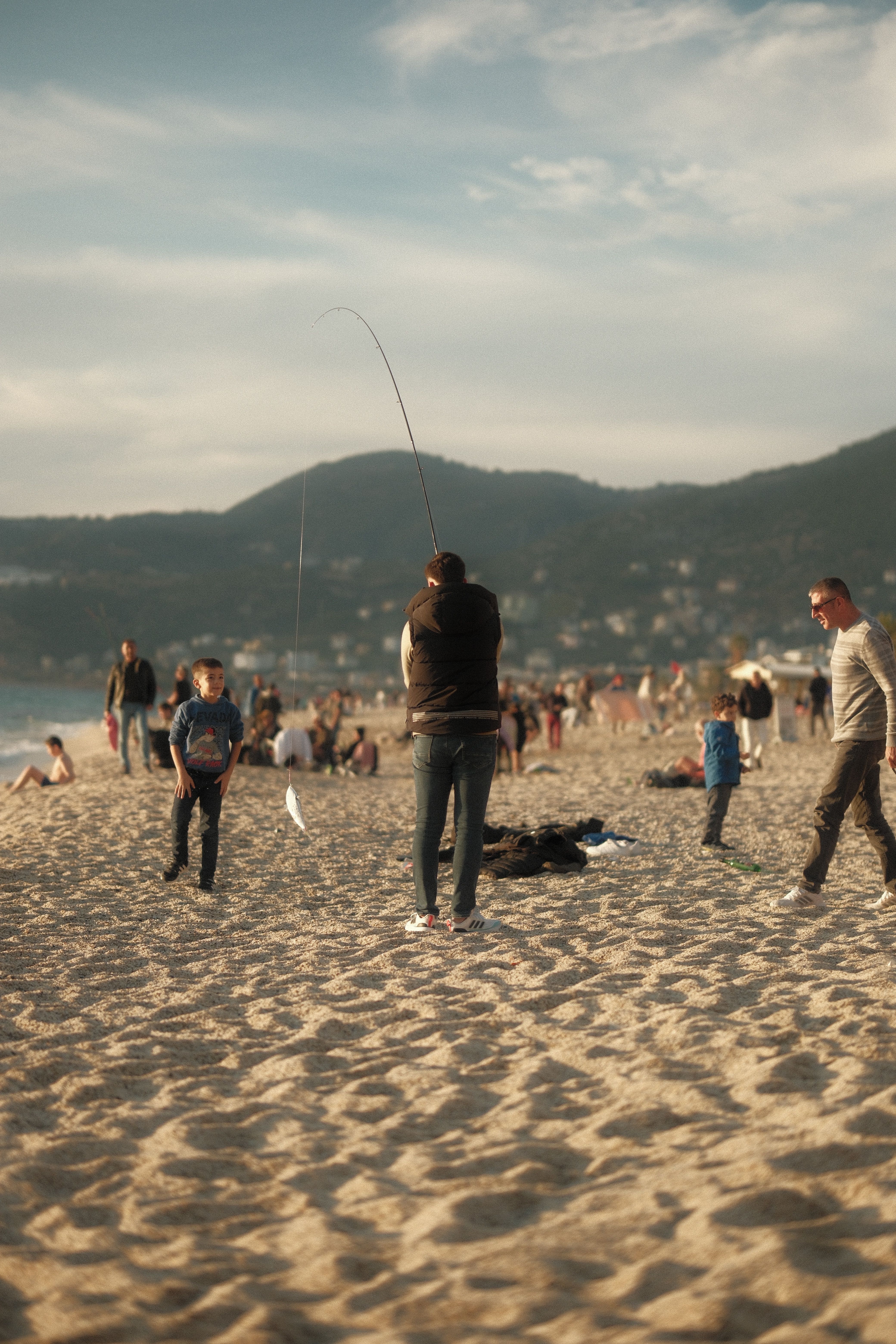 Beach Scene with Fishing and Social Gathering · Free Stock Photo