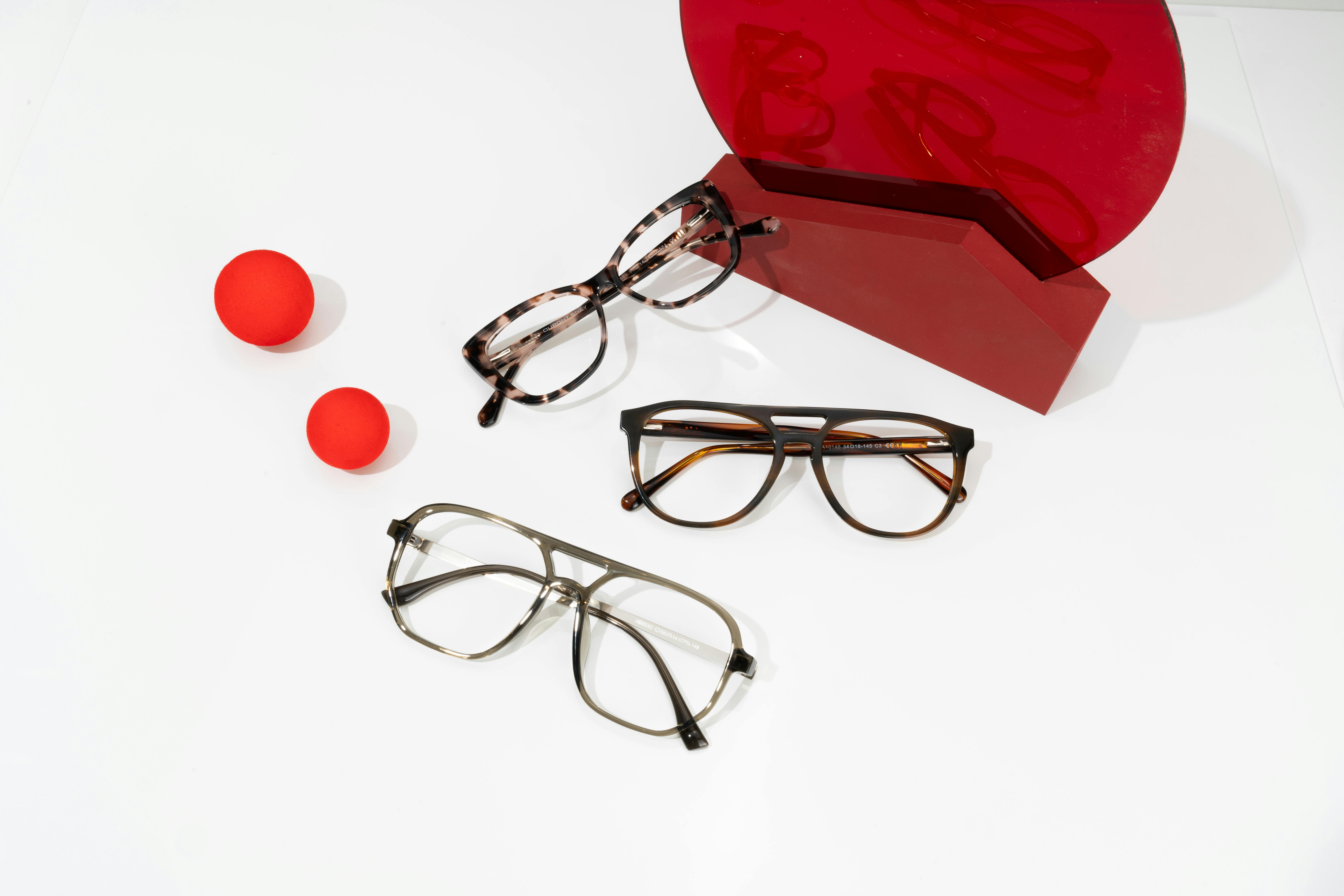 Modern Minimalist Eyewear Display with Red Accents · Free Stock Photo