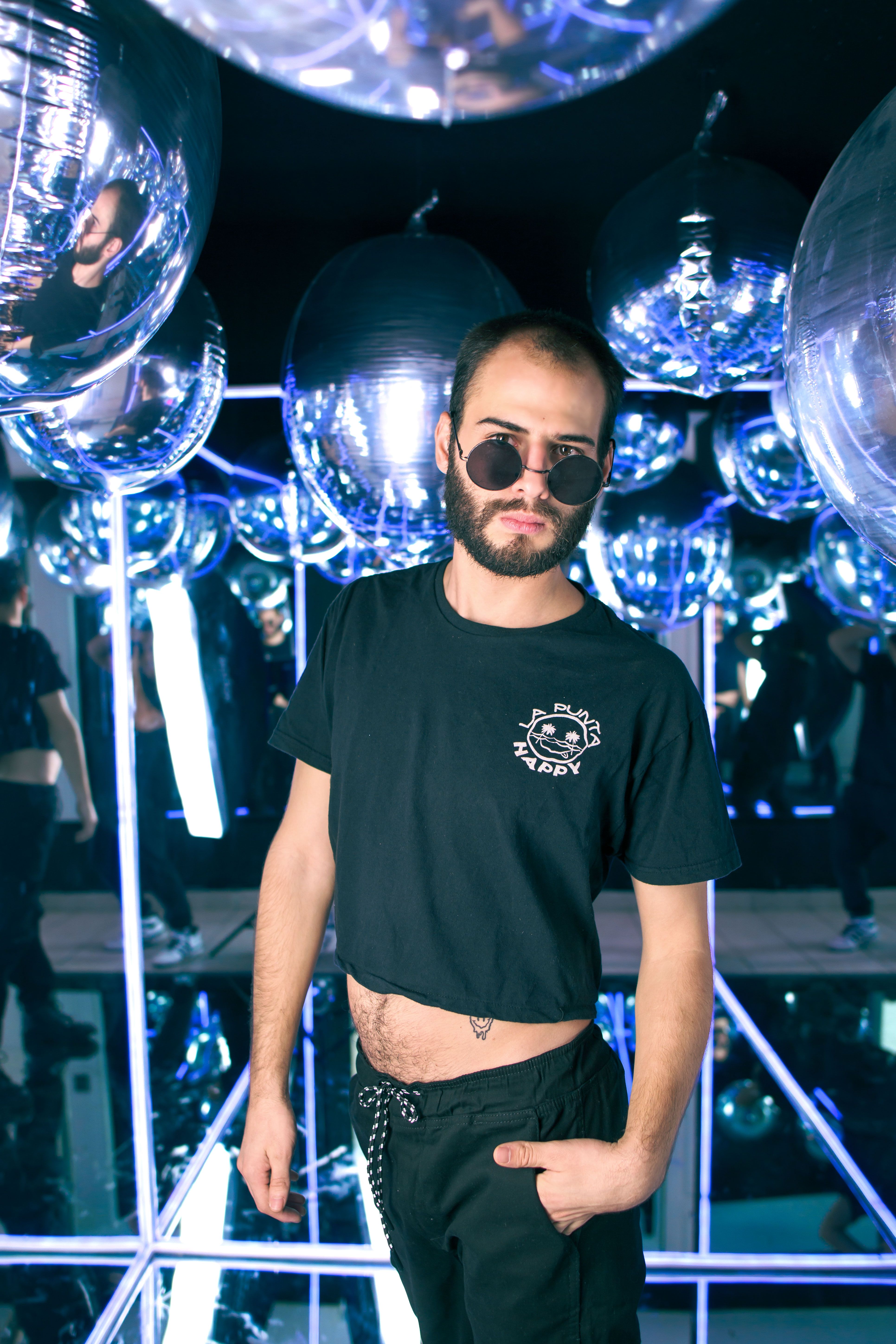 Trendy Man in Disco Ball Reflection Room · Free Stock Photo