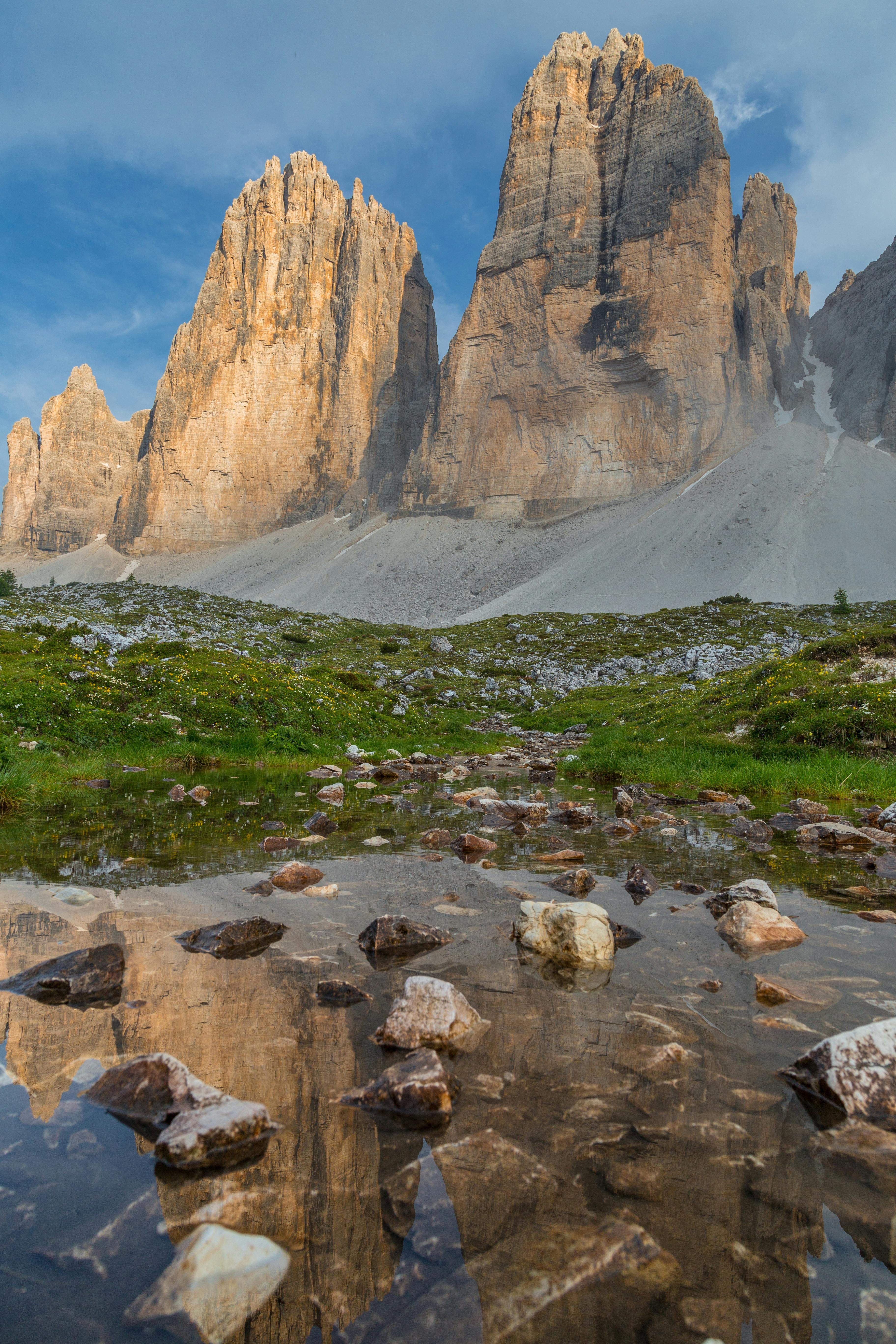 Majestic Dolomites with Reflective Mountain Scenery · Free Stock Photo