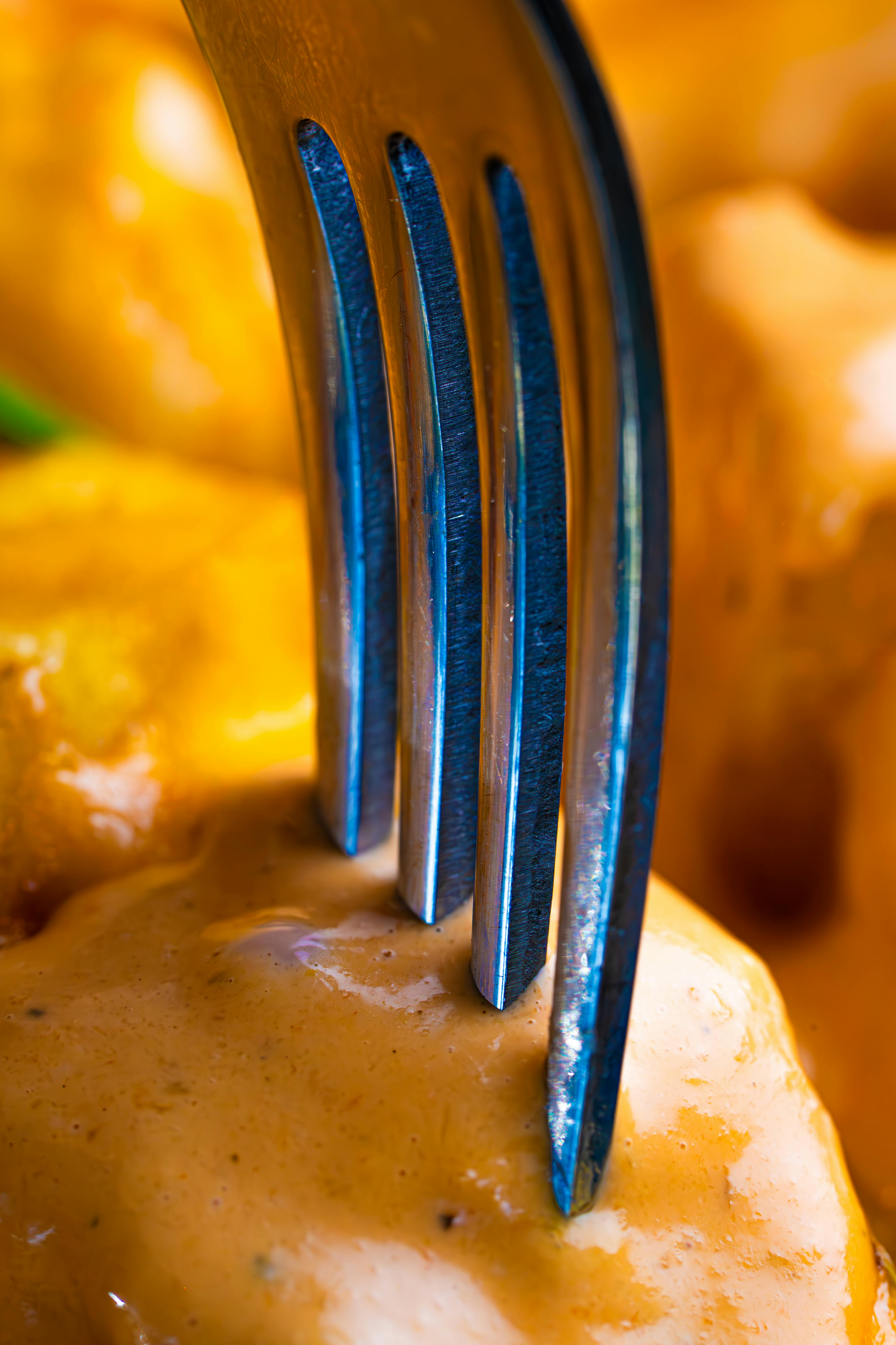 Close-up of Fork Piercing Cheese Covered Pasta · Free Stock Photo