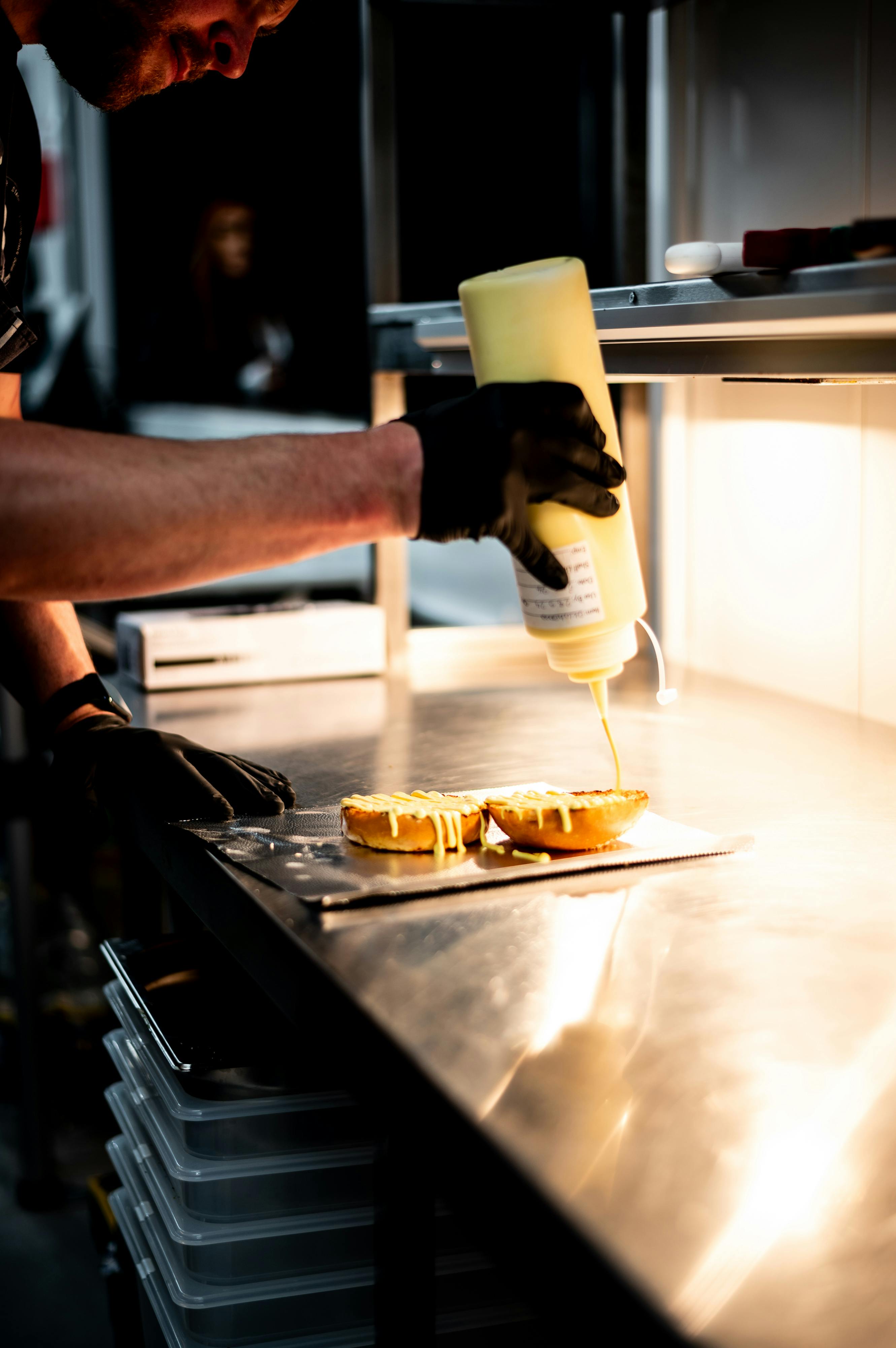 Chef Preparing Gourmet Dish in Modern Kitchen · Free Stock Photo