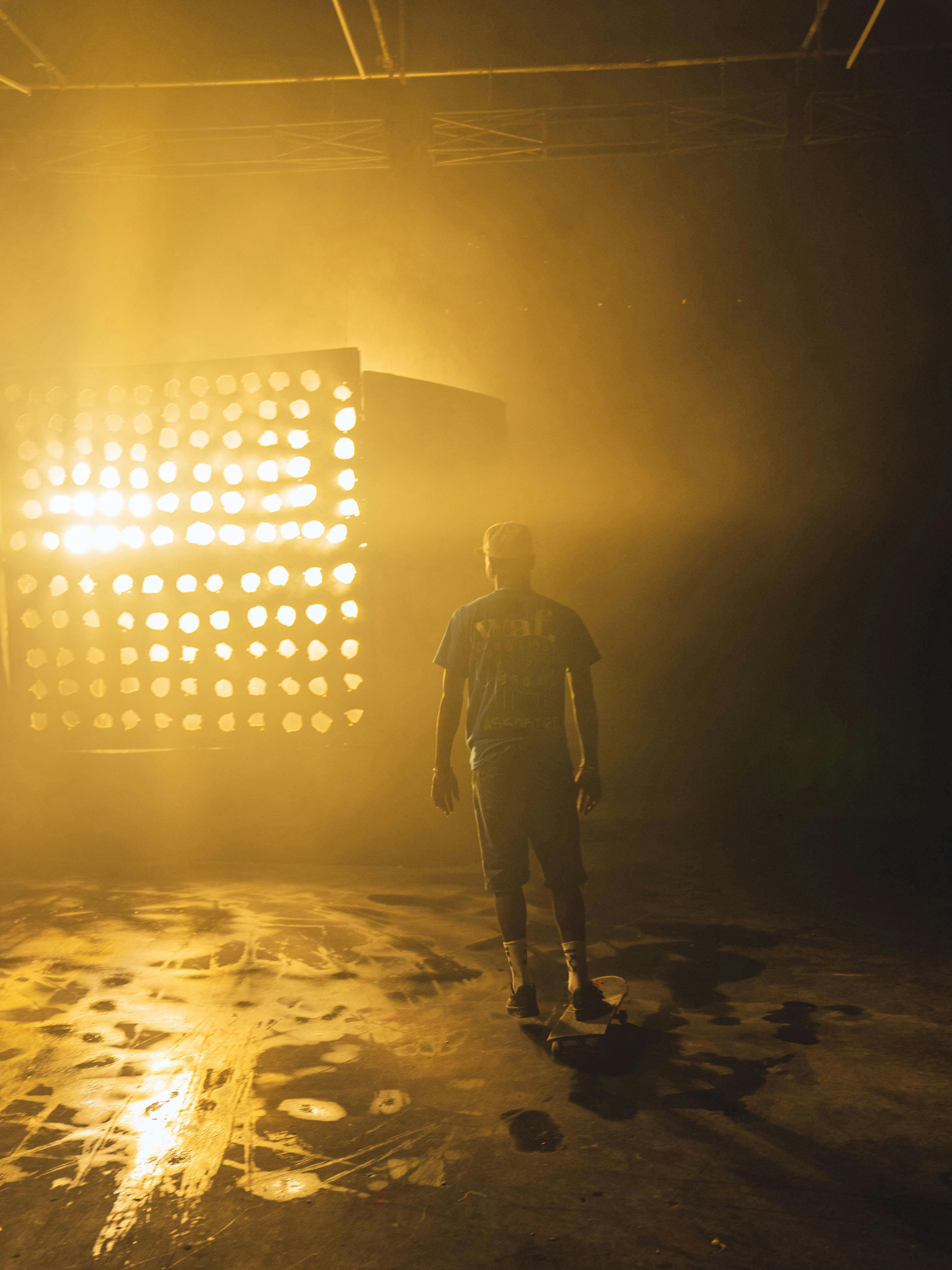 Dramatic Studio Backlight Portrait in Warm Light · Free Stock Photo