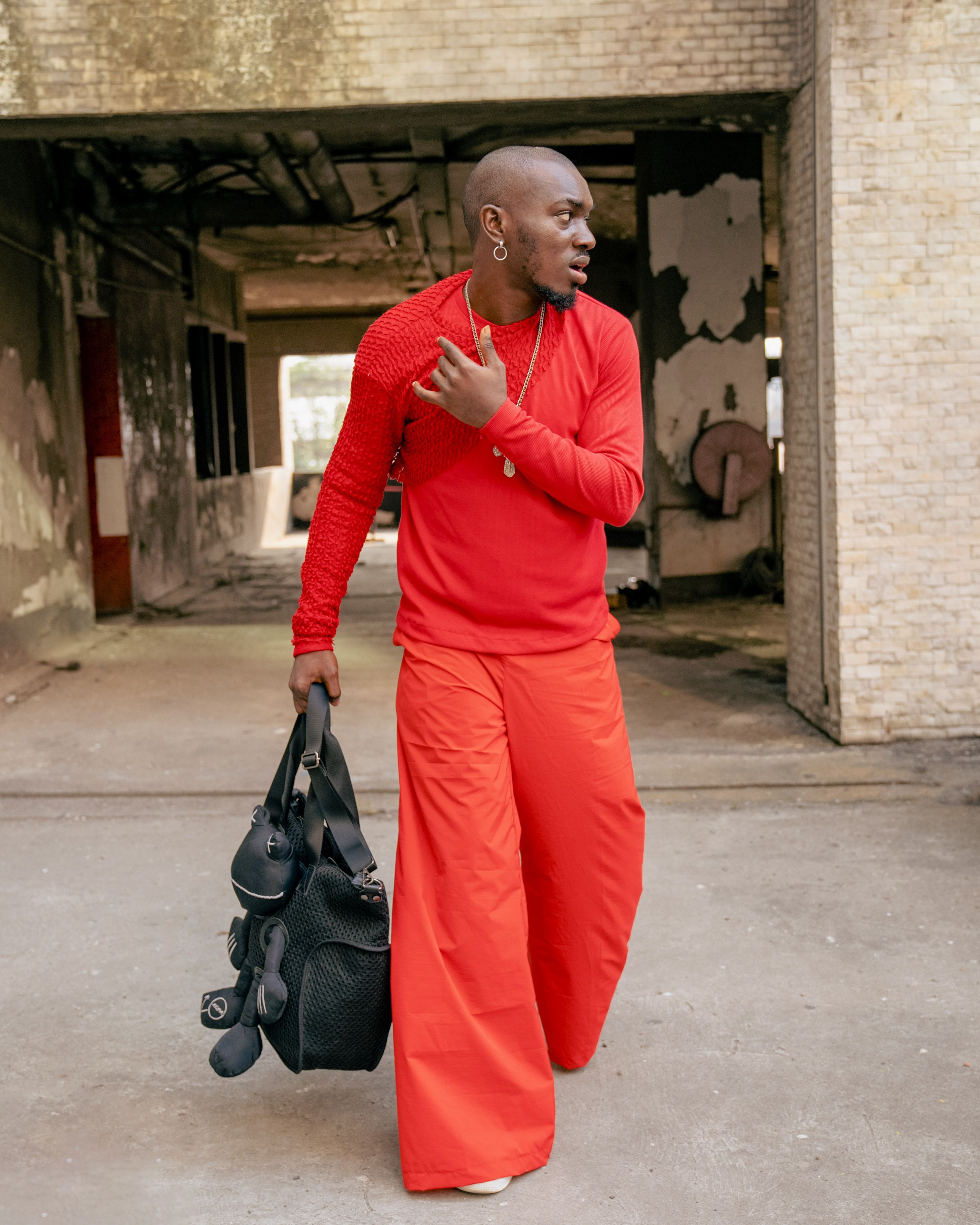 Stylish Man in Vibrant Red Outfit Outdoors · Free Stock Photo