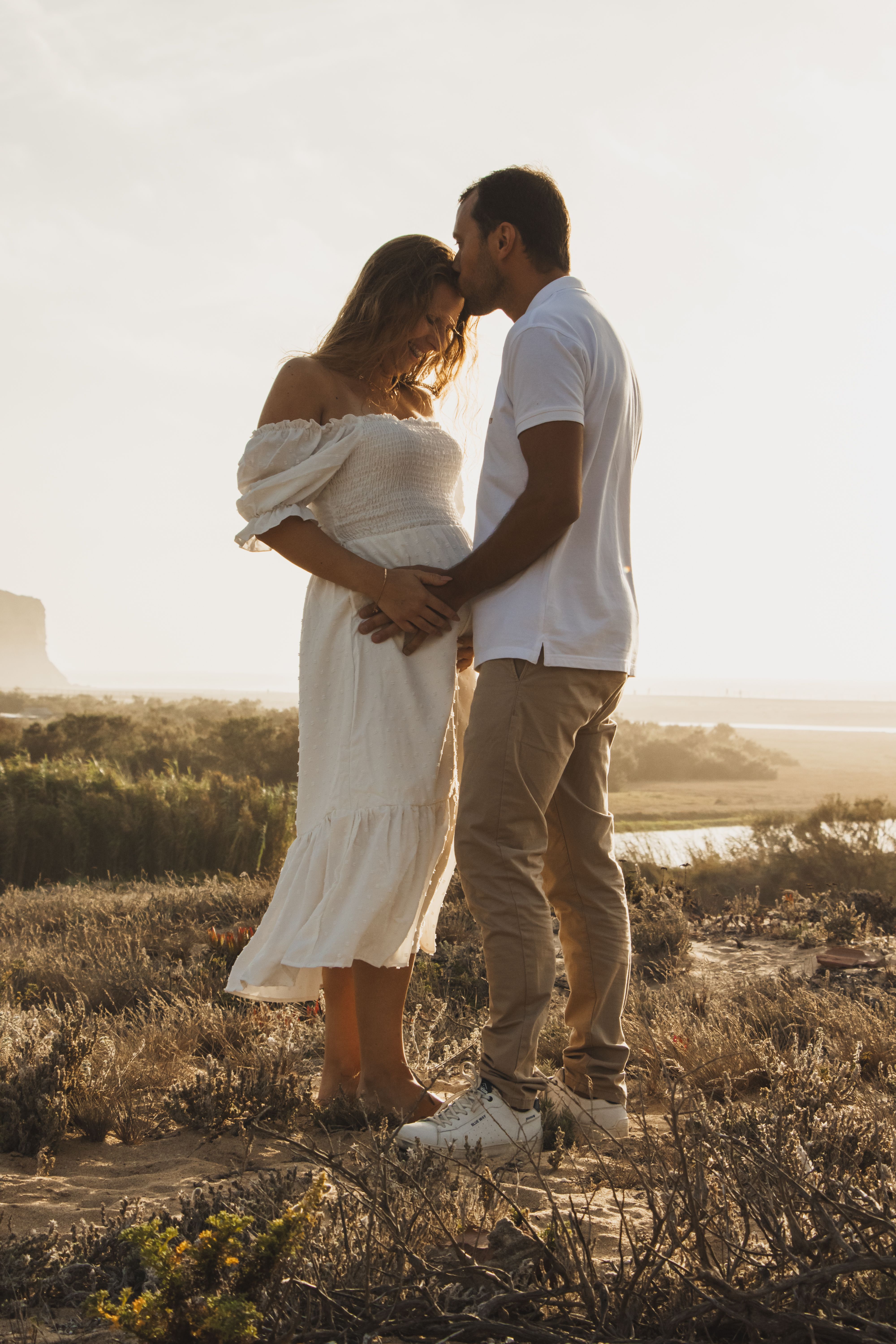 Romantic Maternity Portrait at Sunset on Beach · Free Stock Photo