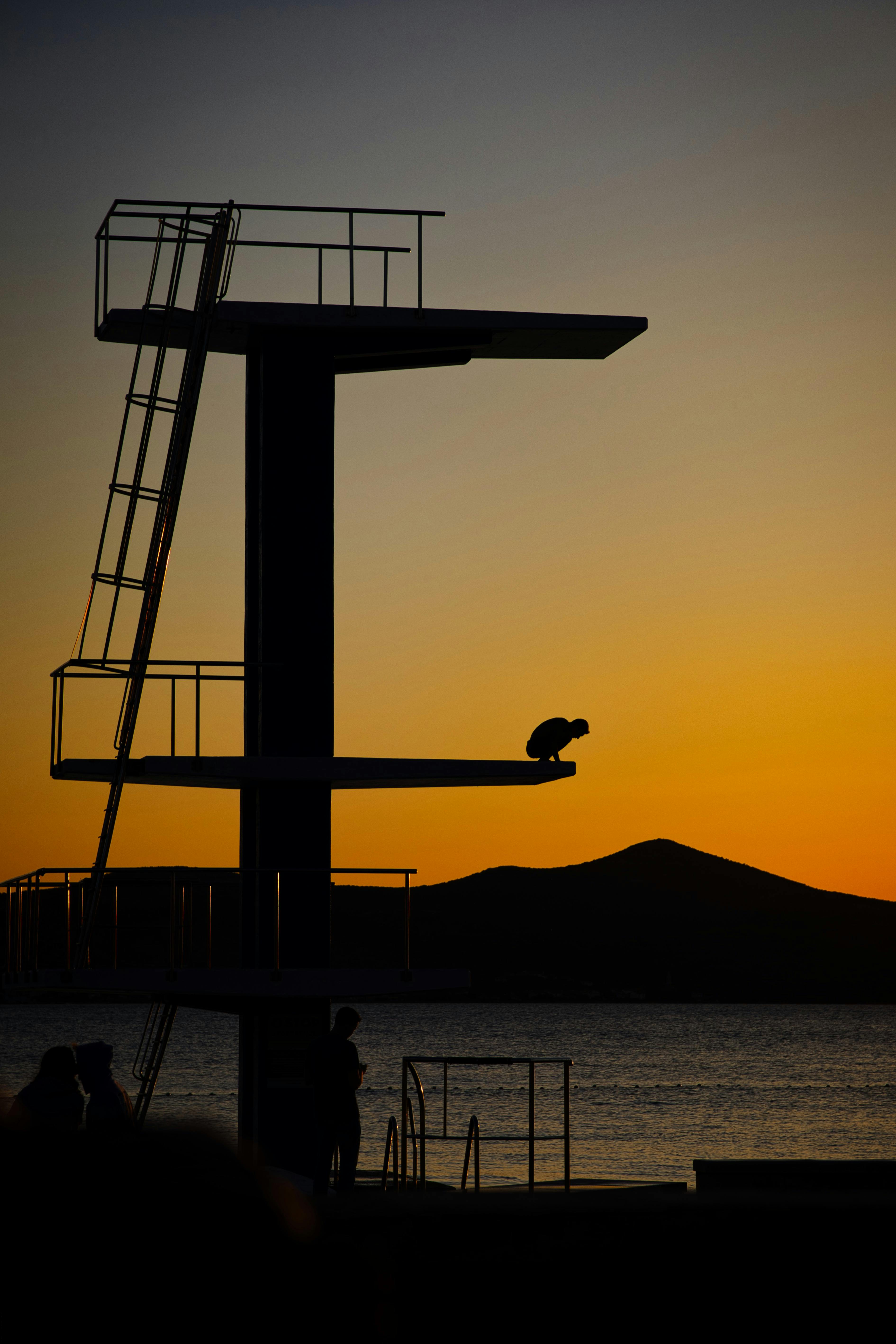 Diver at Sunset on Zadar's Diving Platform · Free Stock Photo