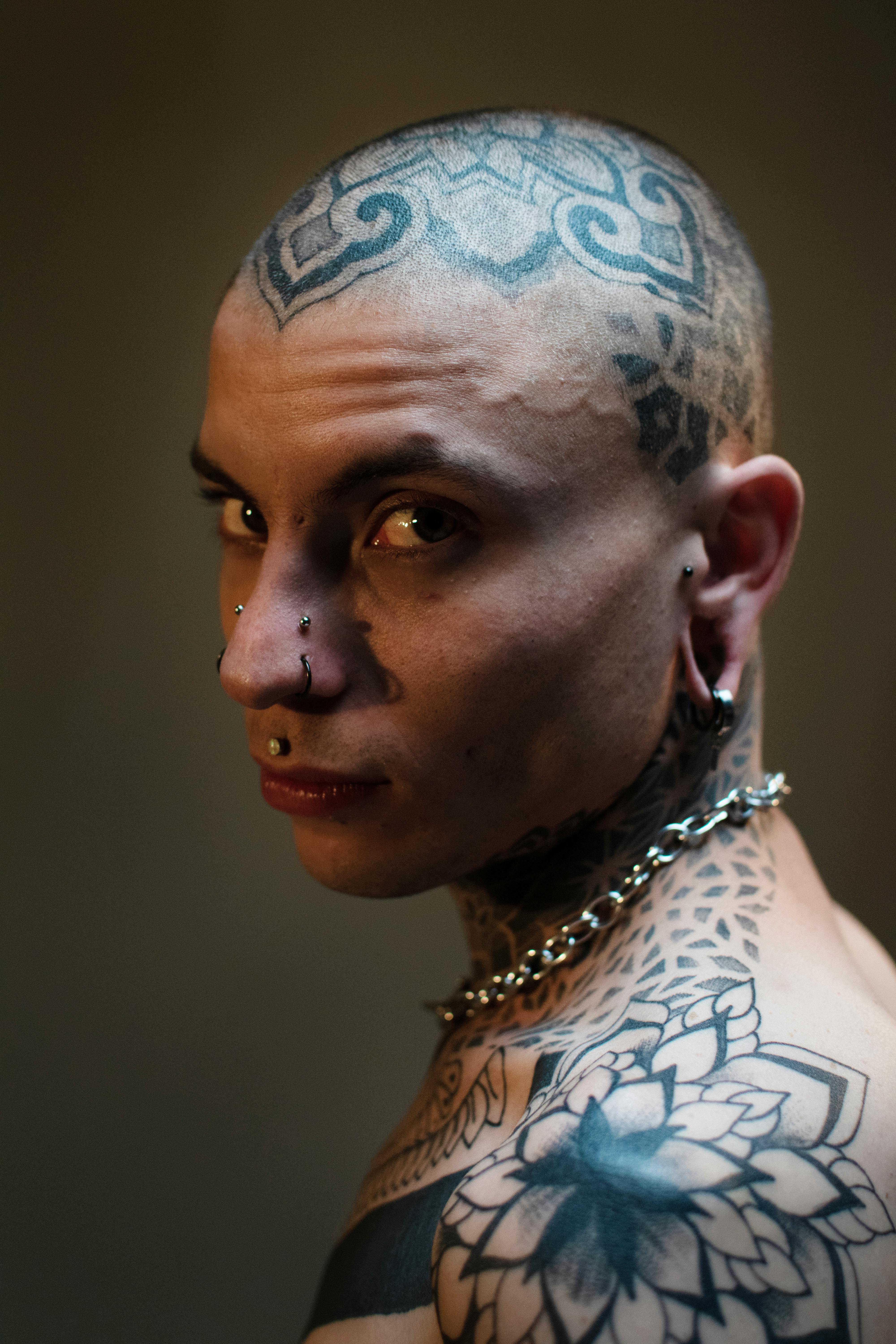 Expressive Tattooed Portrait with Piercings · Free Stock Photo