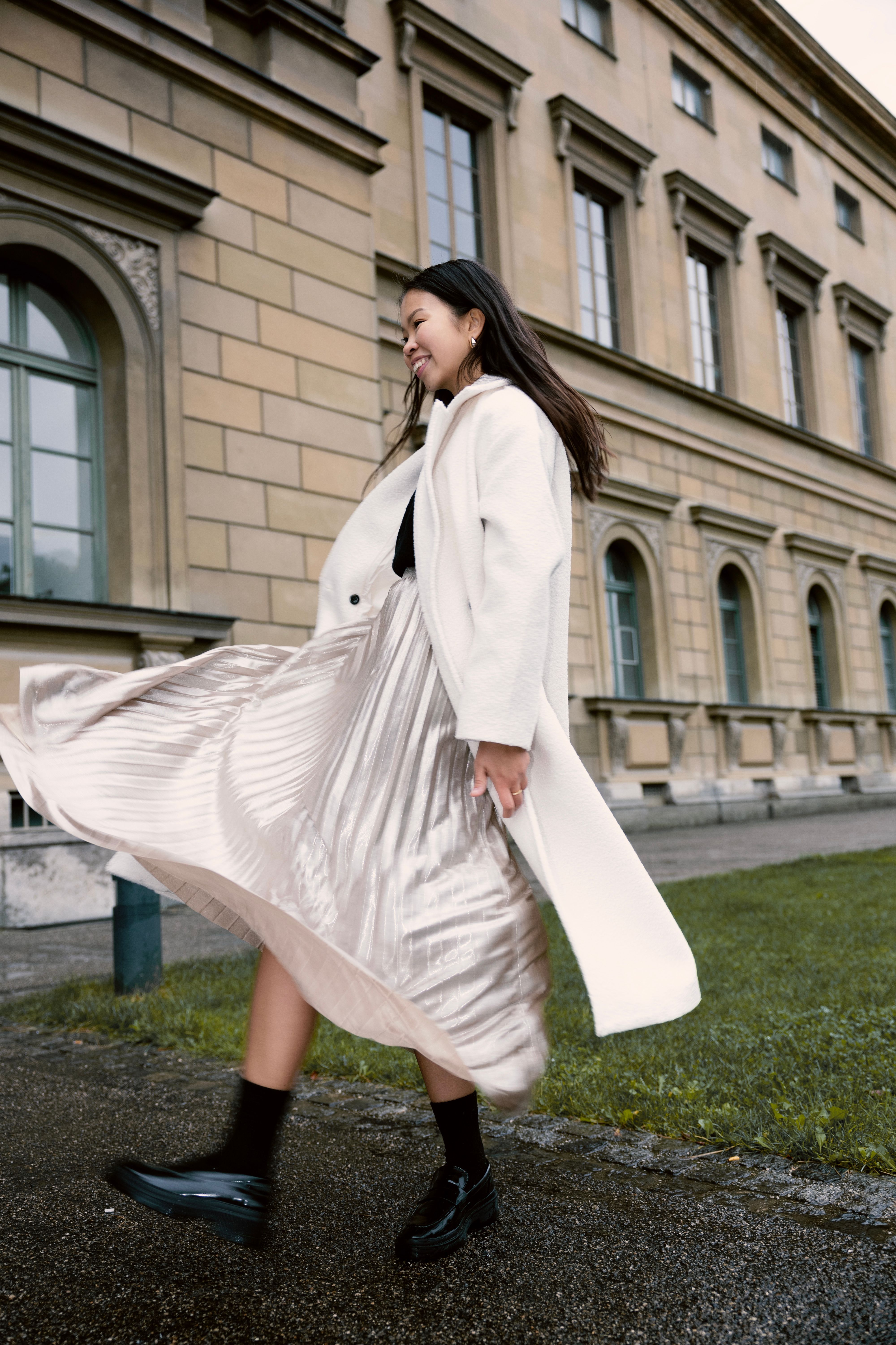 Young Woman Walking in Munich Street Fashion · Free Stock Photo