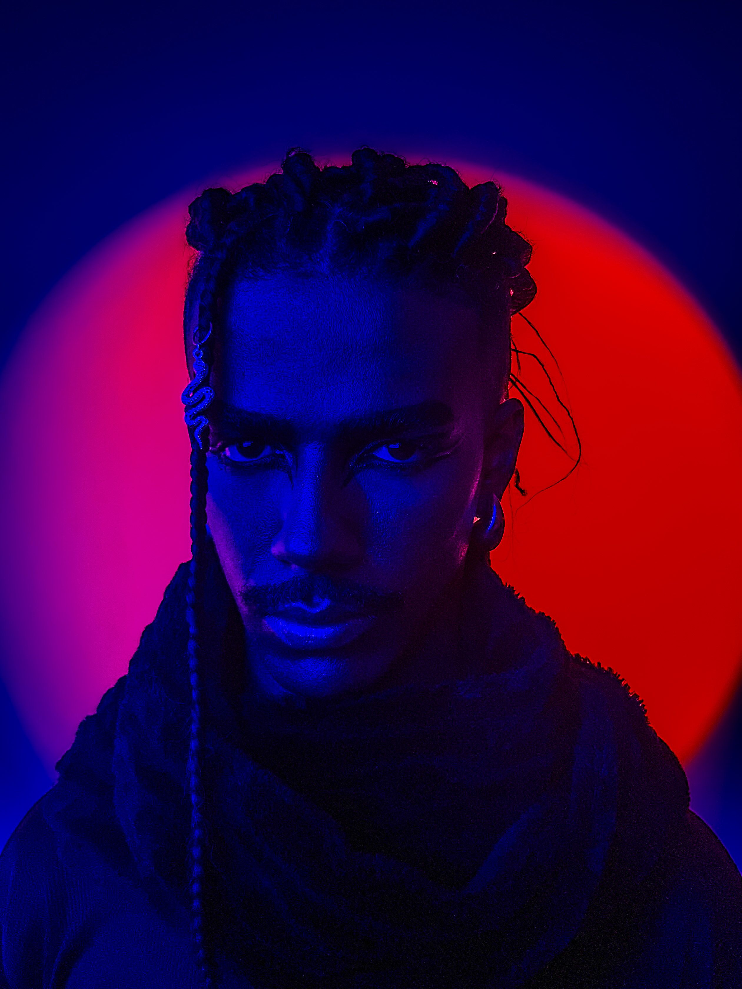 Moody Portrait with Bold Red and Blue Lighting · Free Stock Photo