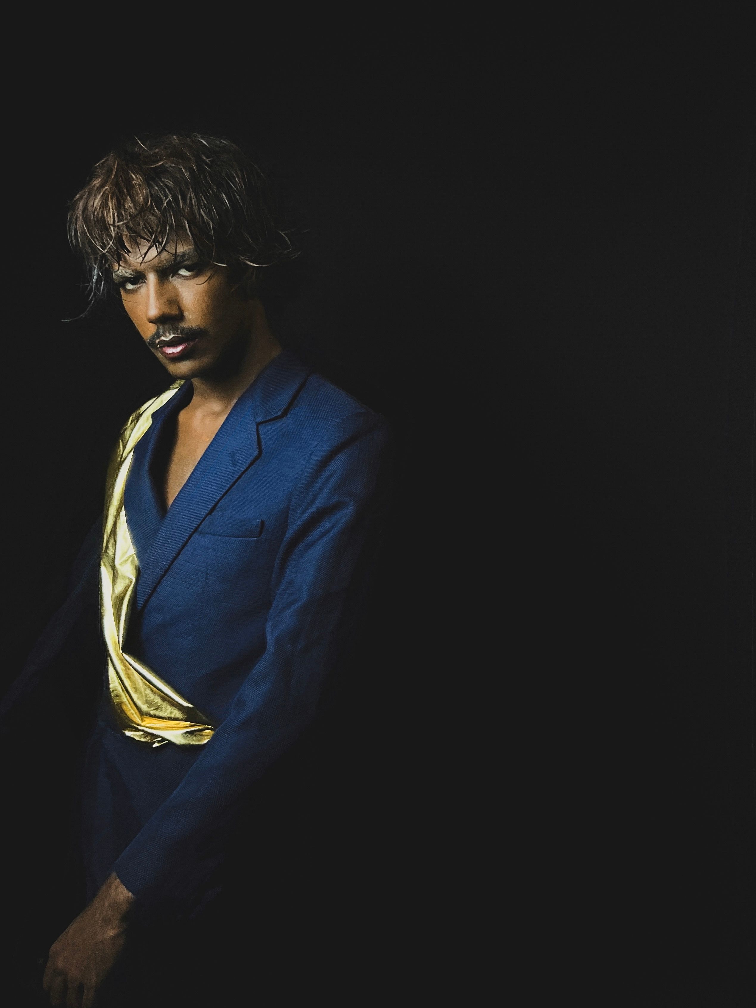 Stylish Man in Blue Suit with Gold Accent · Free Stock Photo