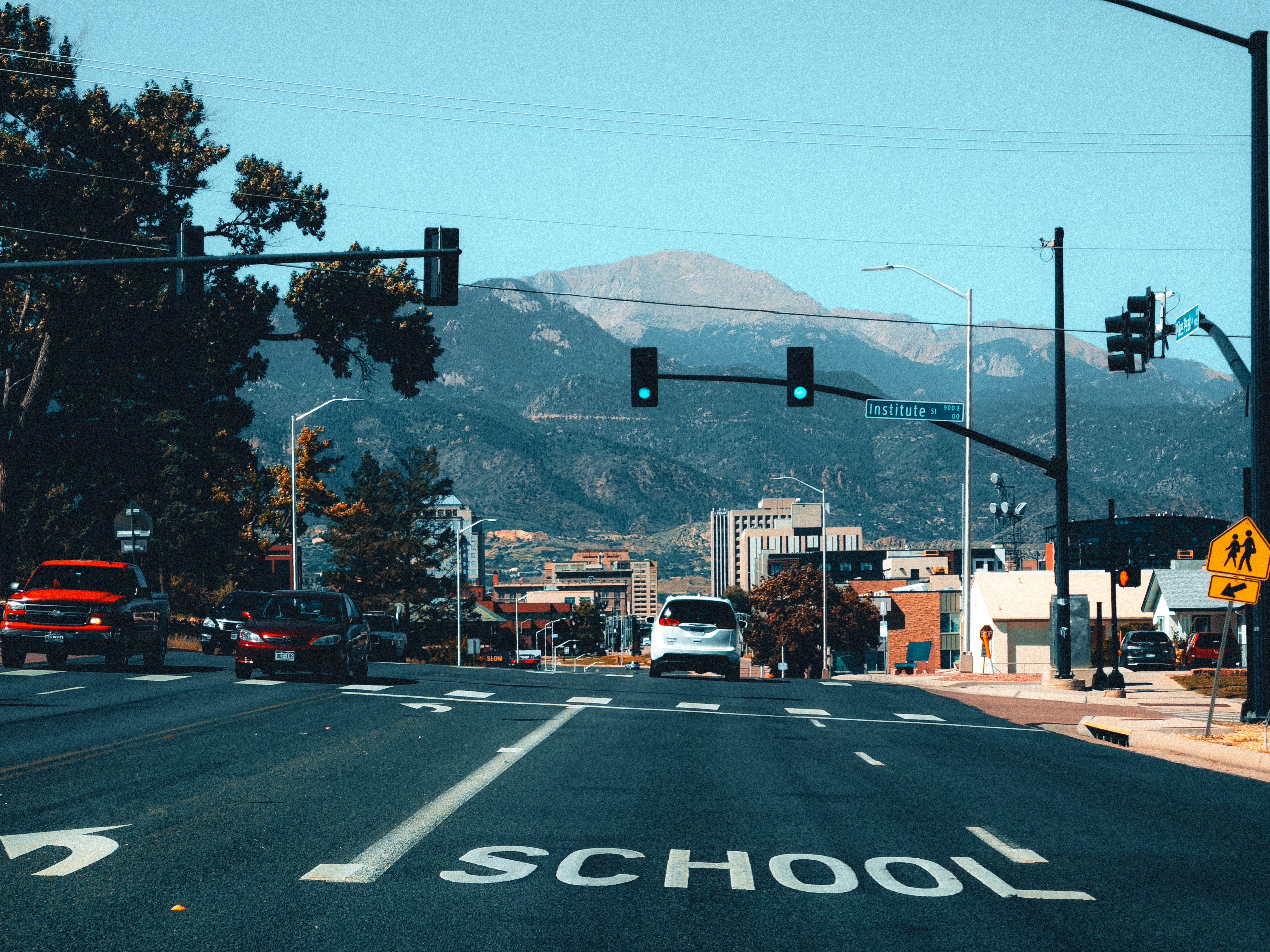 Urban Street Scene with Scenic Mountain Backdrop · Free Stock Photo
