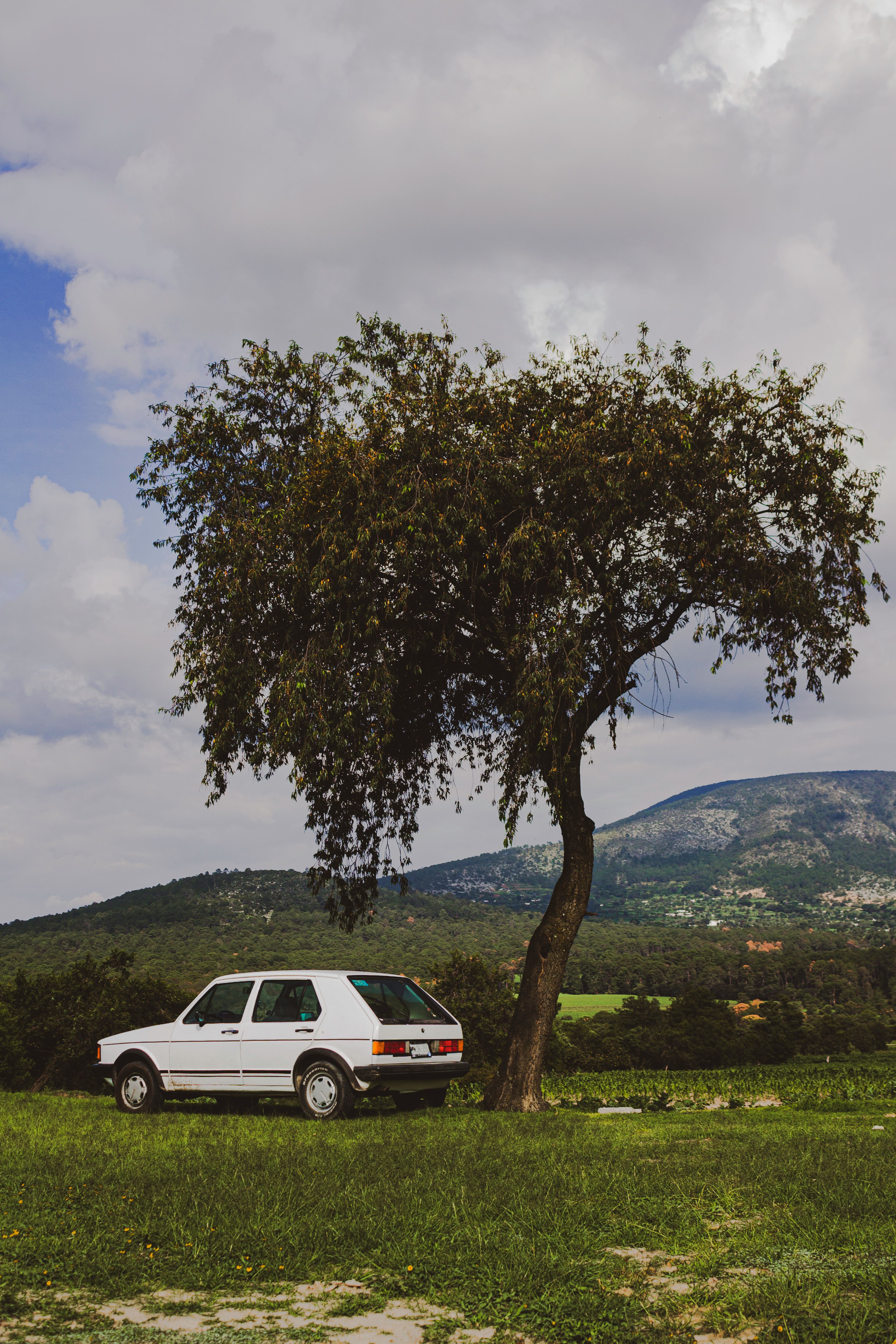 Classic White Car in Idyllic Rural Landscape · Free Stock Photo